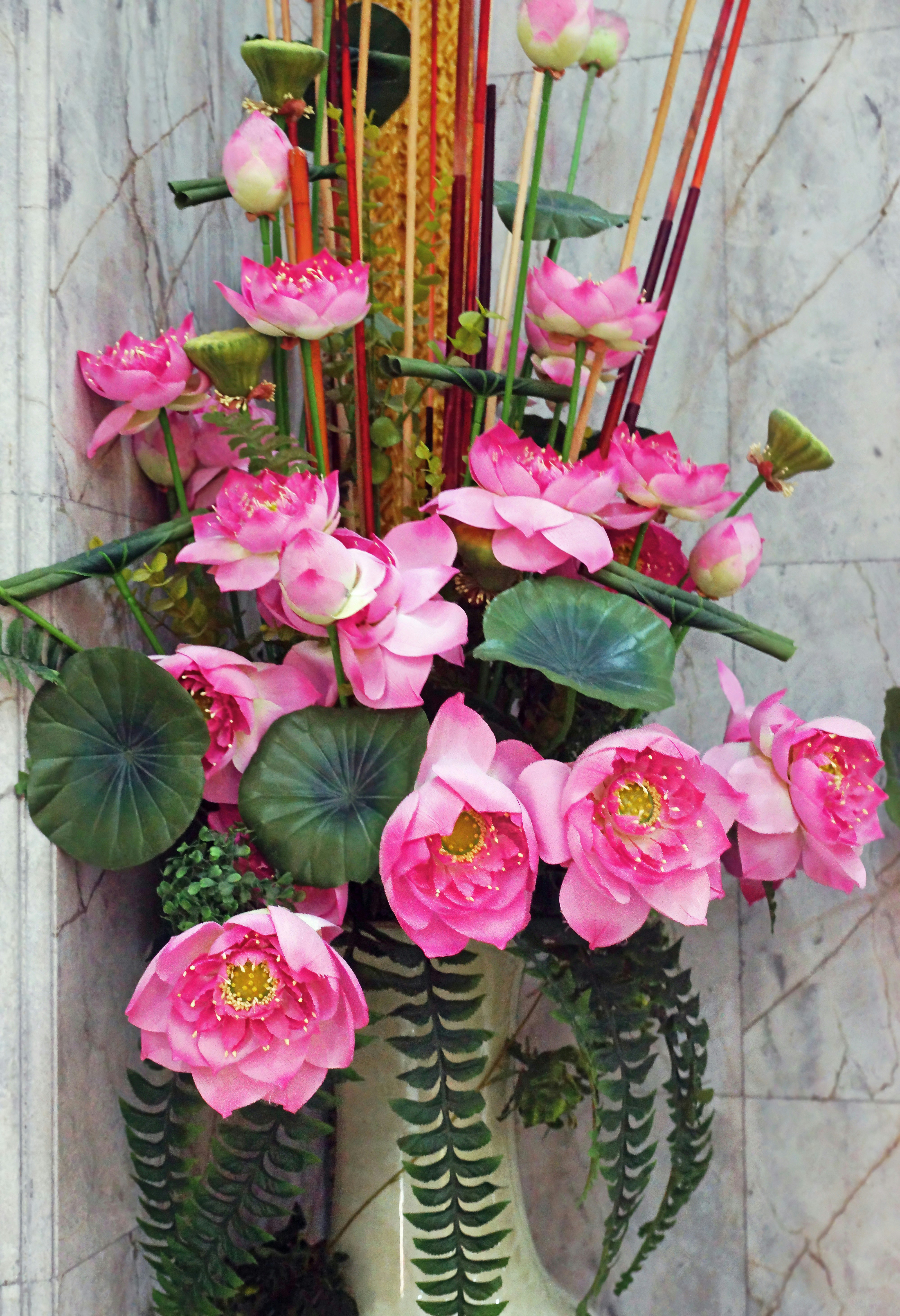 Petal Cascade: Pink Lotus Blooms in a Marble Vase