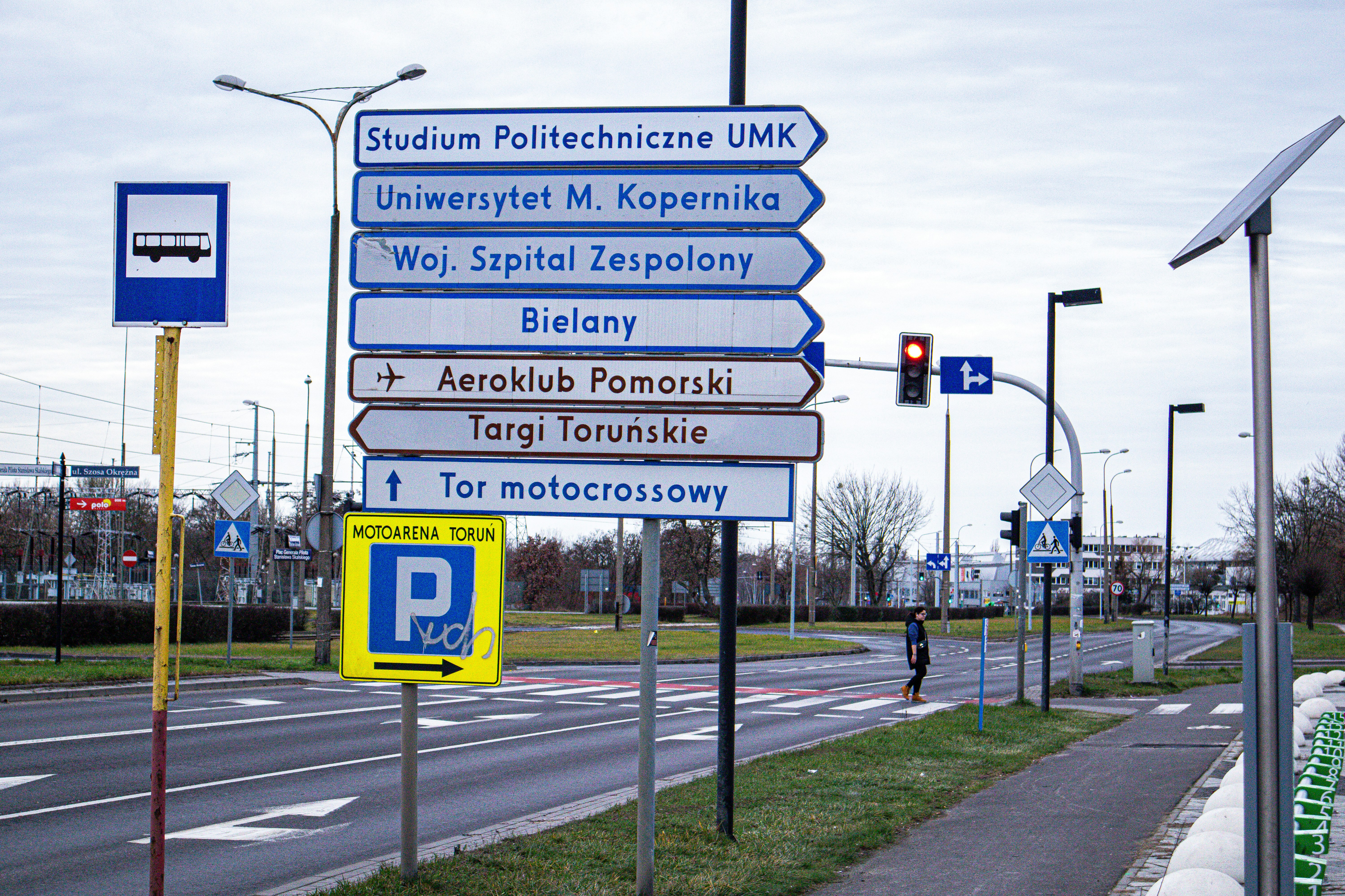 A bunch of street signs on the side of the road photo – Free Poland ...