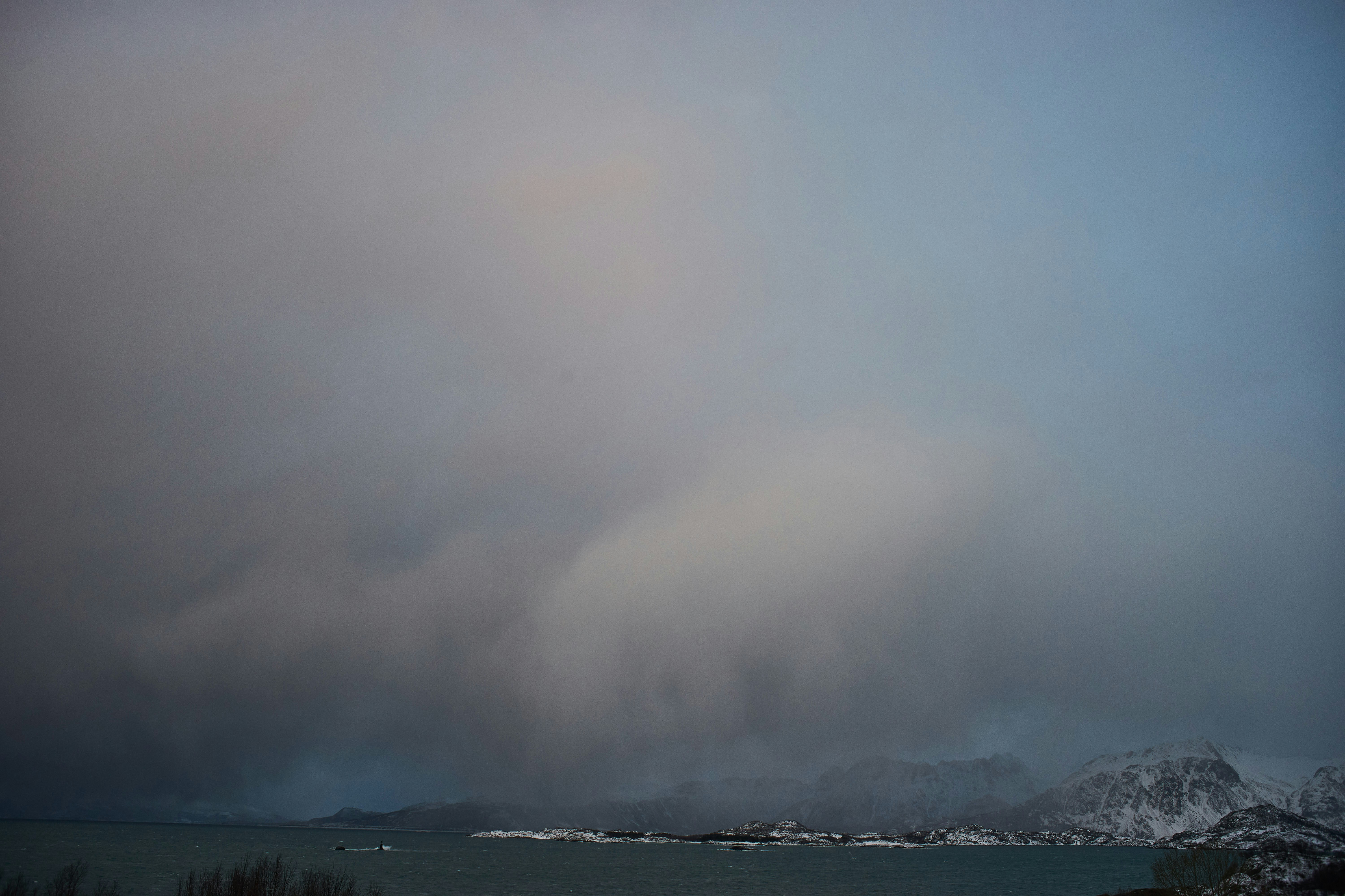 A large body of water under a cloudy sky photo – Free Nature Image on ...