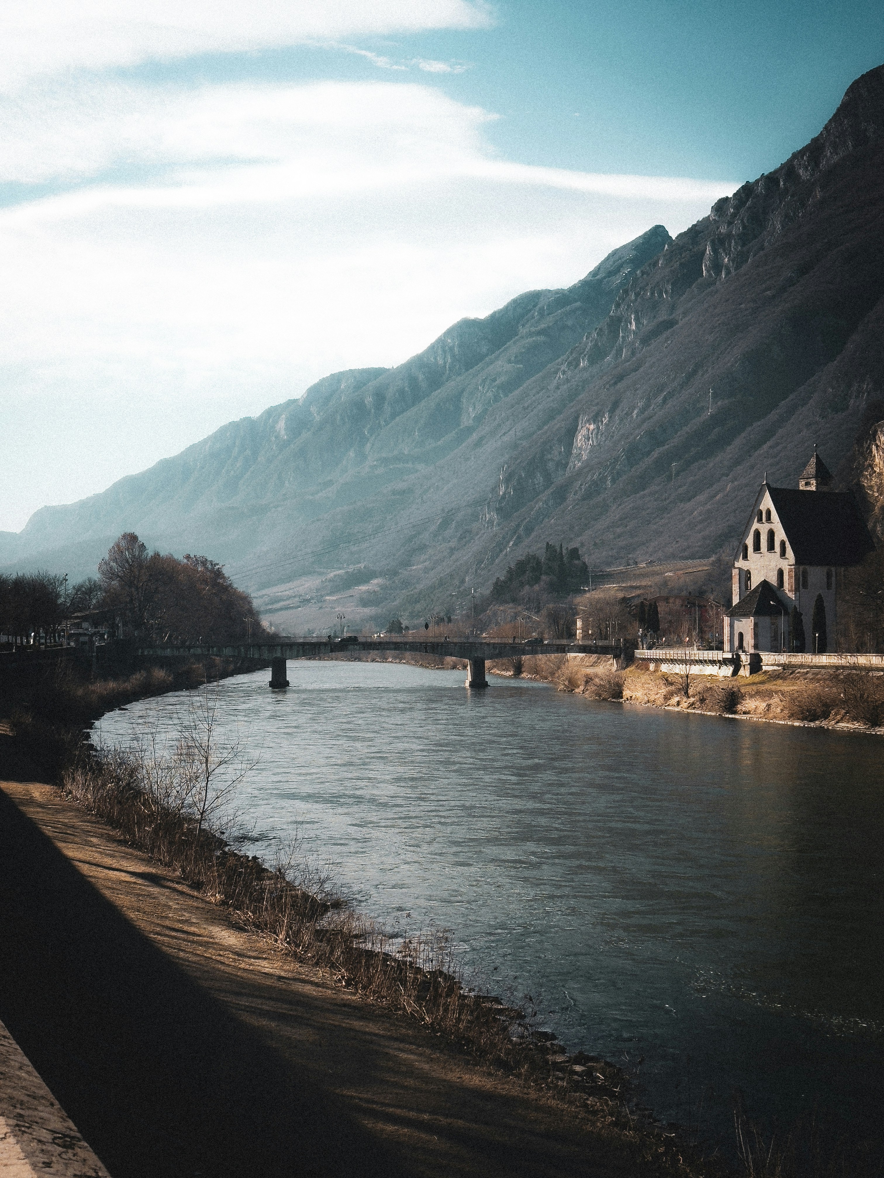Alpine Church by the River: A Quiet Panorama