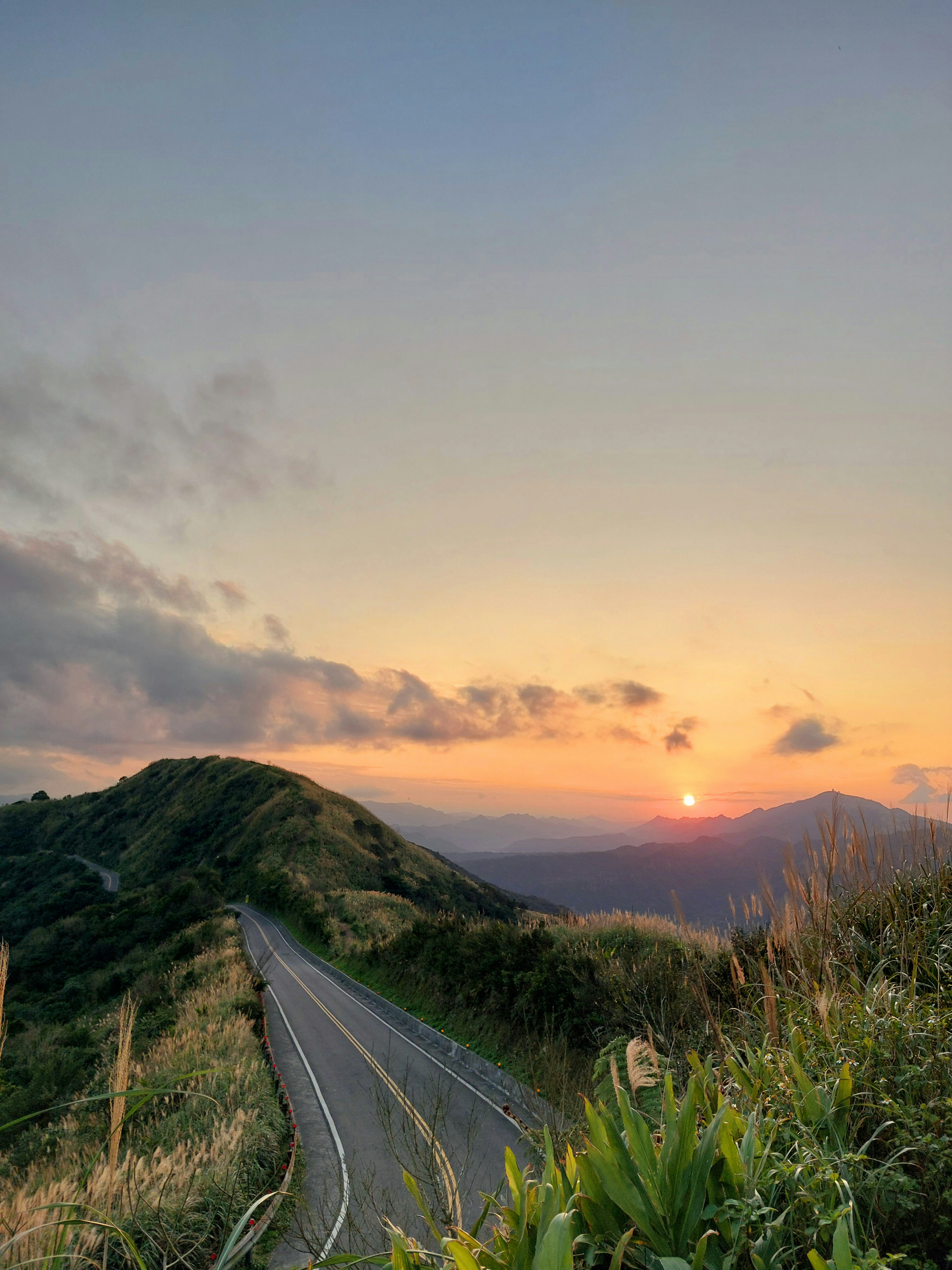 Sunset Over the Winding Mountain Road