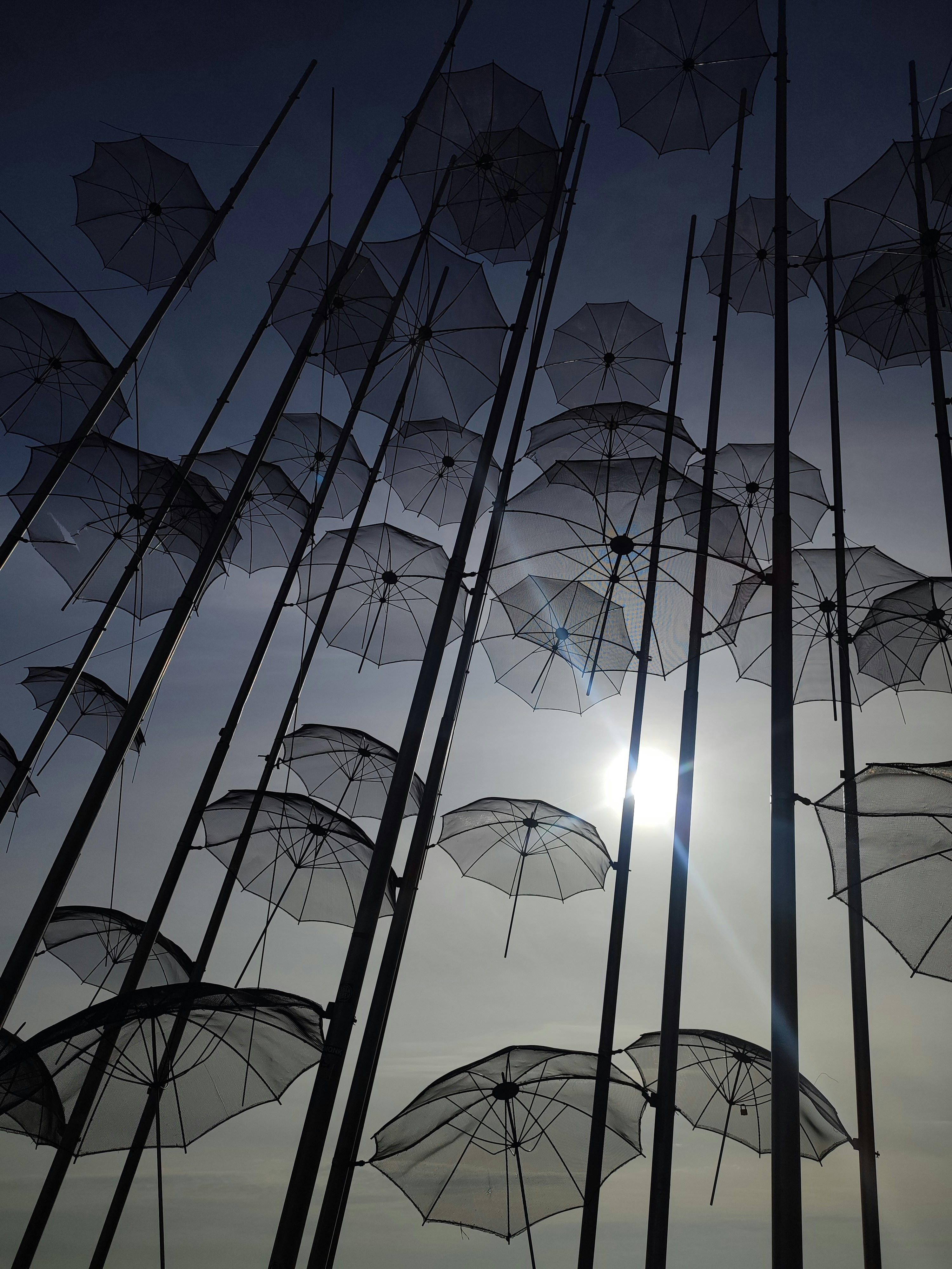 A bunch of umbrellas that are in the air photo – Free Grey Image on ...