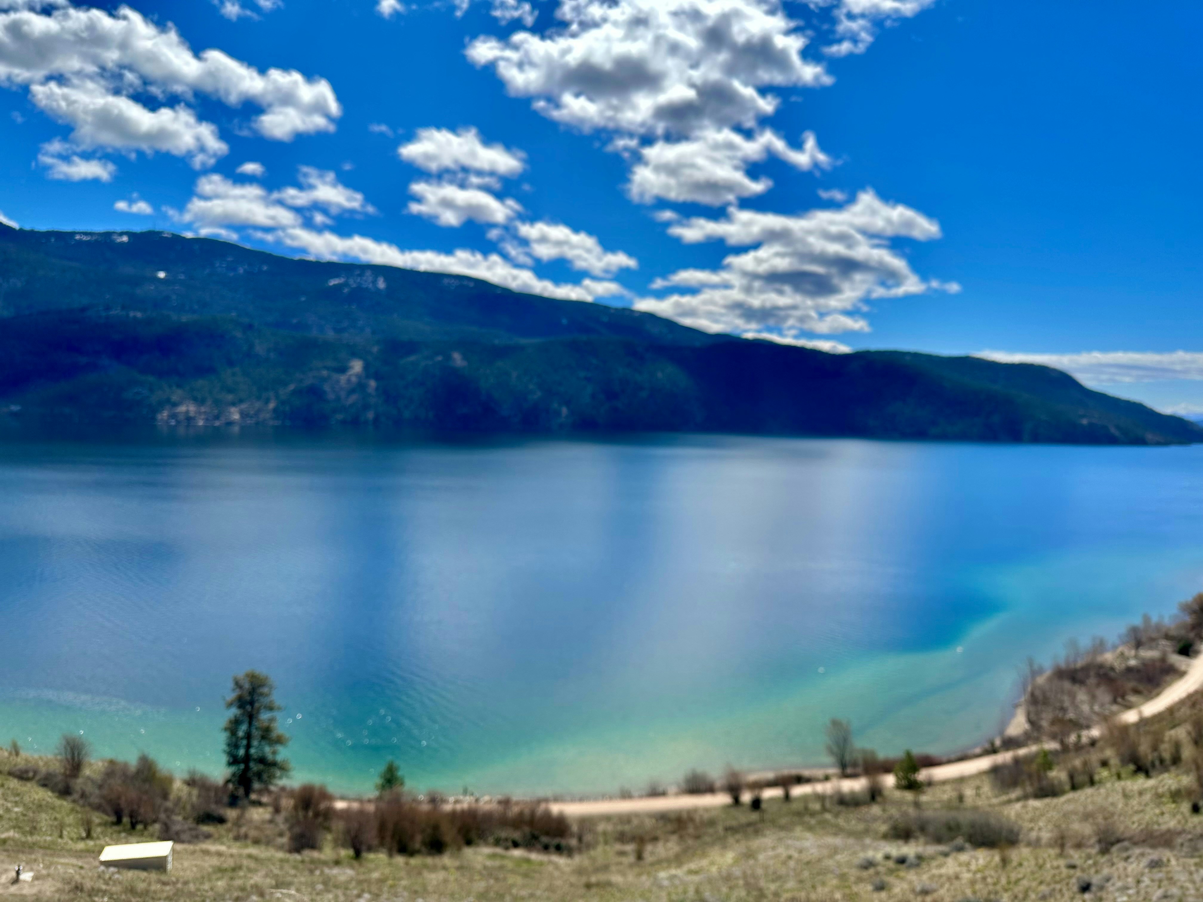Turquoise Edge: A Quiet Alpine Lake Under a Sky of Whispers