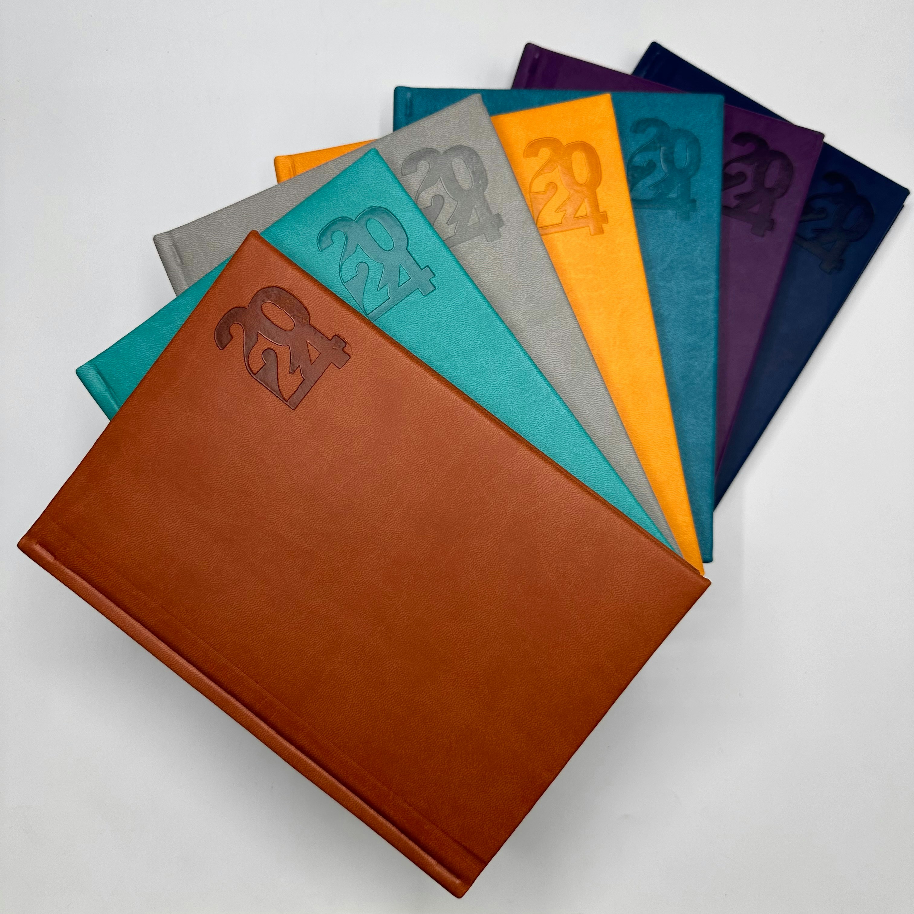 A bunch of different colored notebooks sitting next to each other photo ...