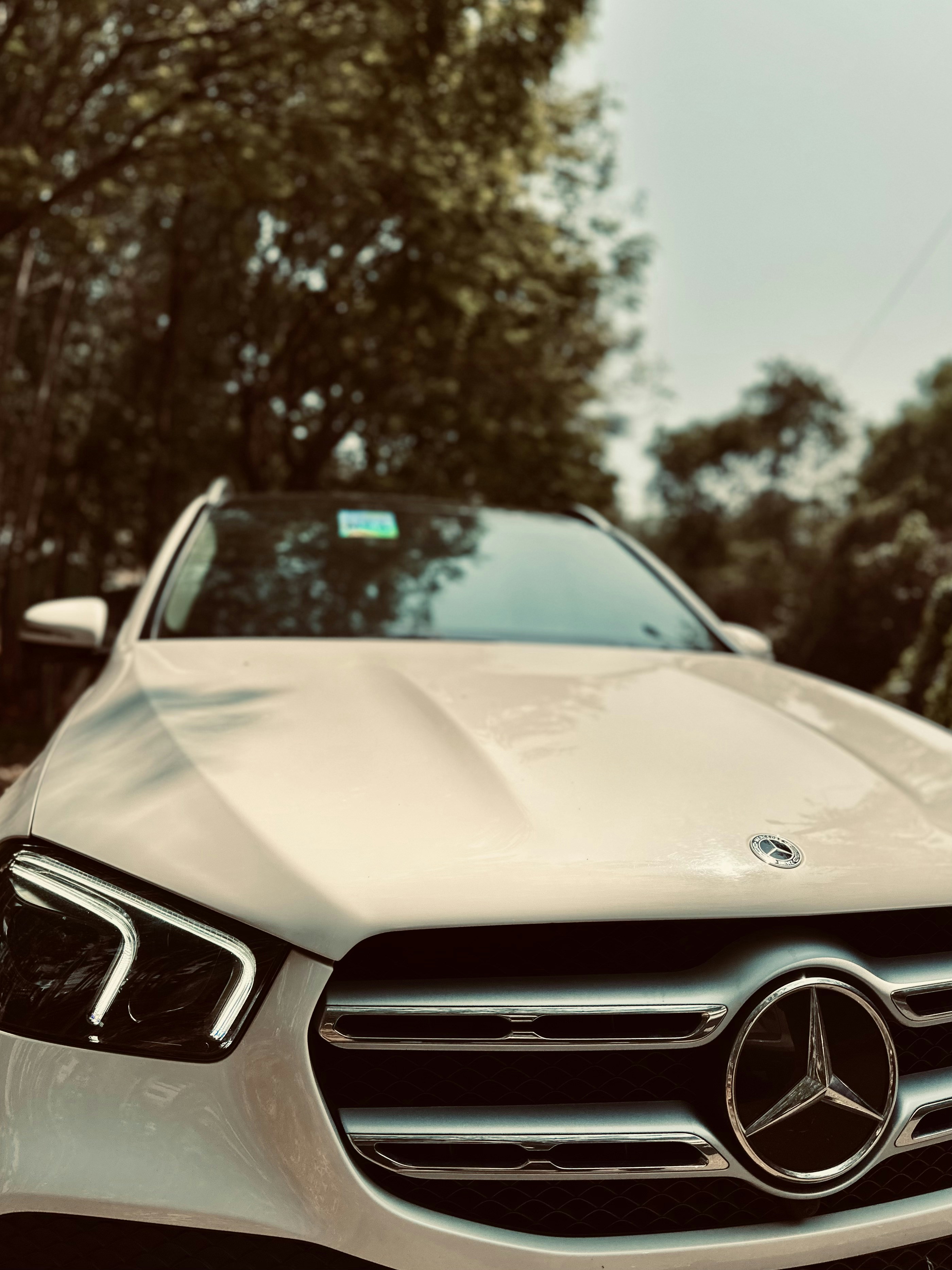 A white car parked on the side of the road photo – Free Aesthetic Image ...