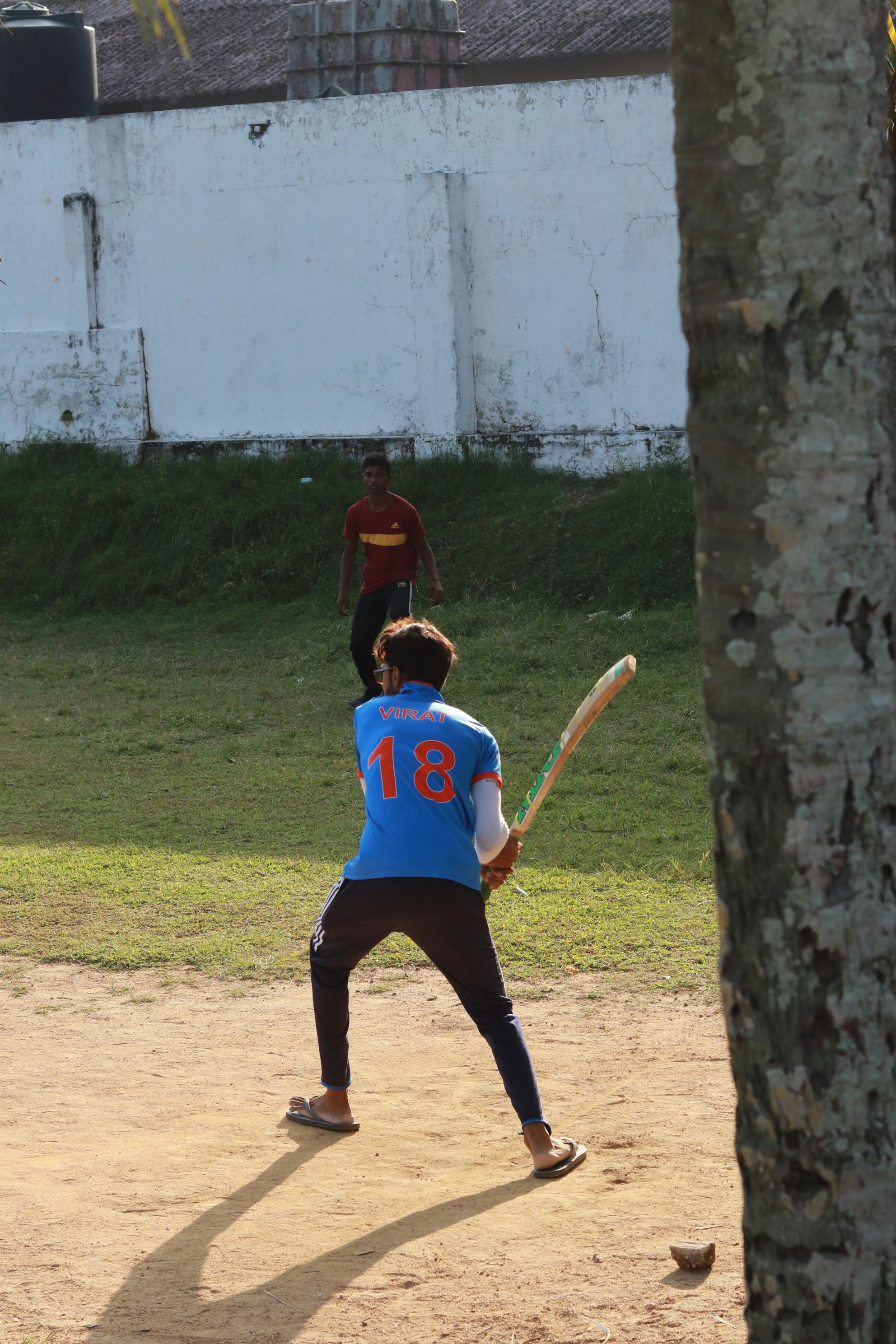 Number 18's Stance: Focused Batting on a Dusty Field
