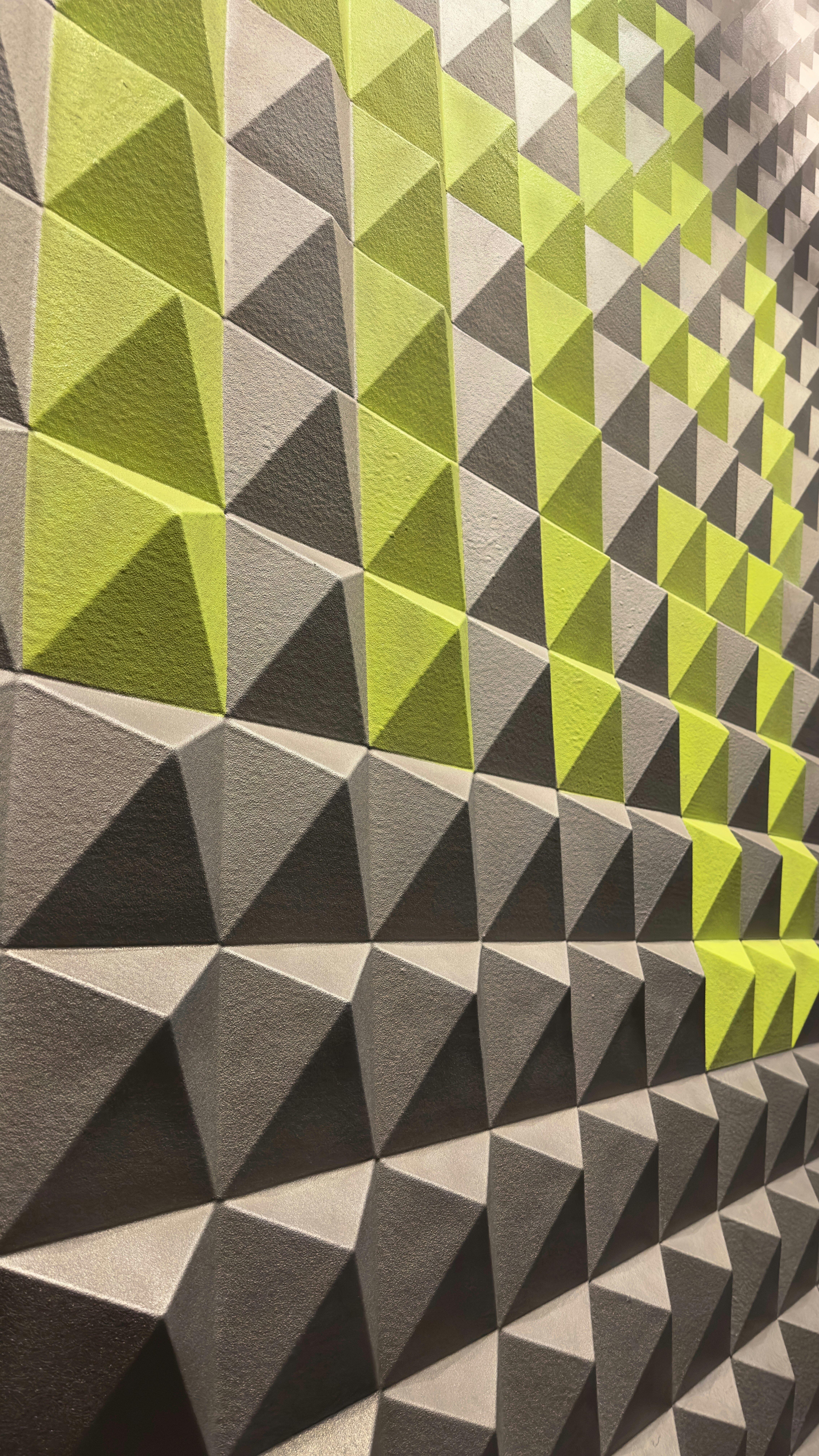 A wall that has a bunch of different shapes on it photo – Free Textura ...