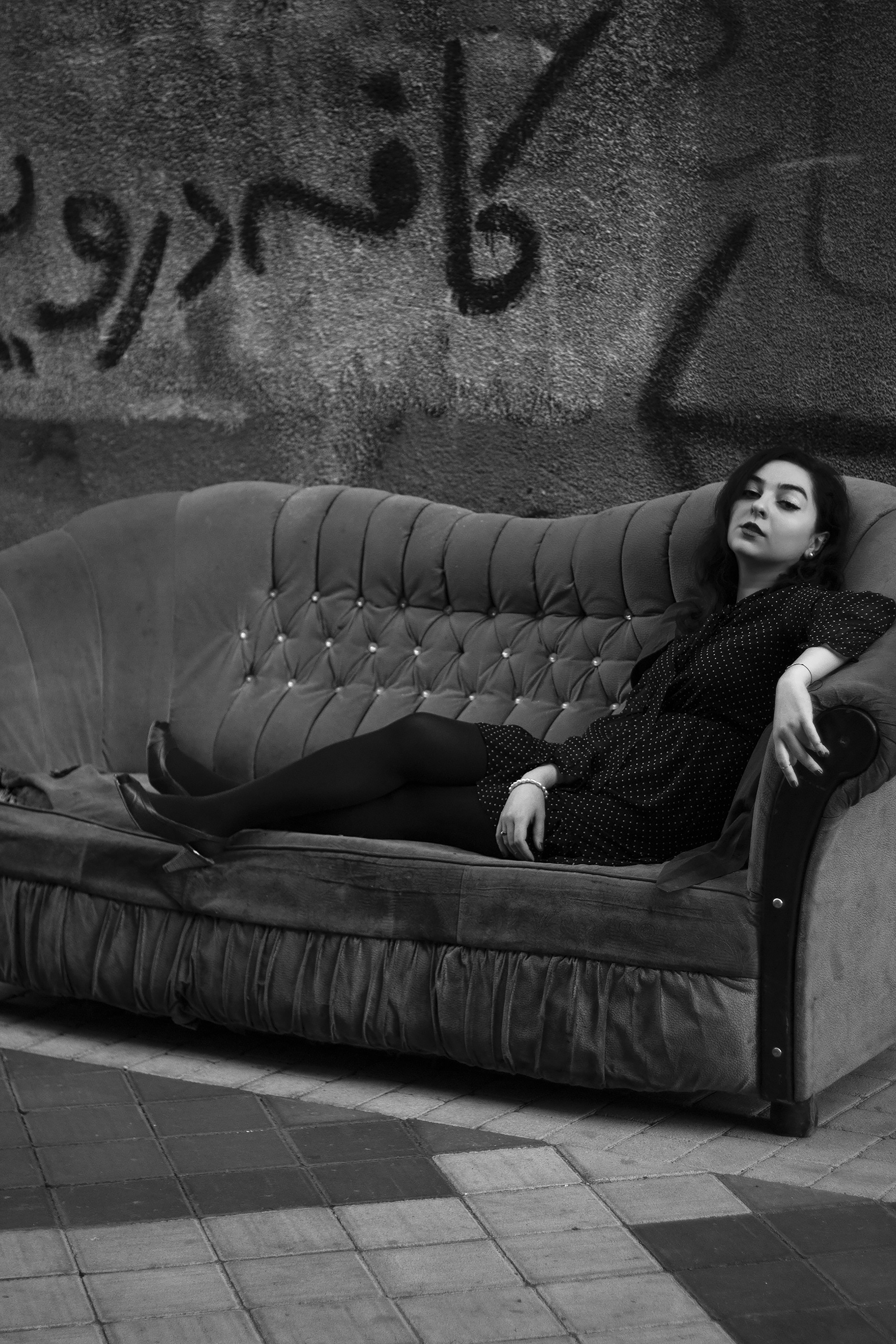 Midnight Velvet: A Reclined Portrait on City Walls