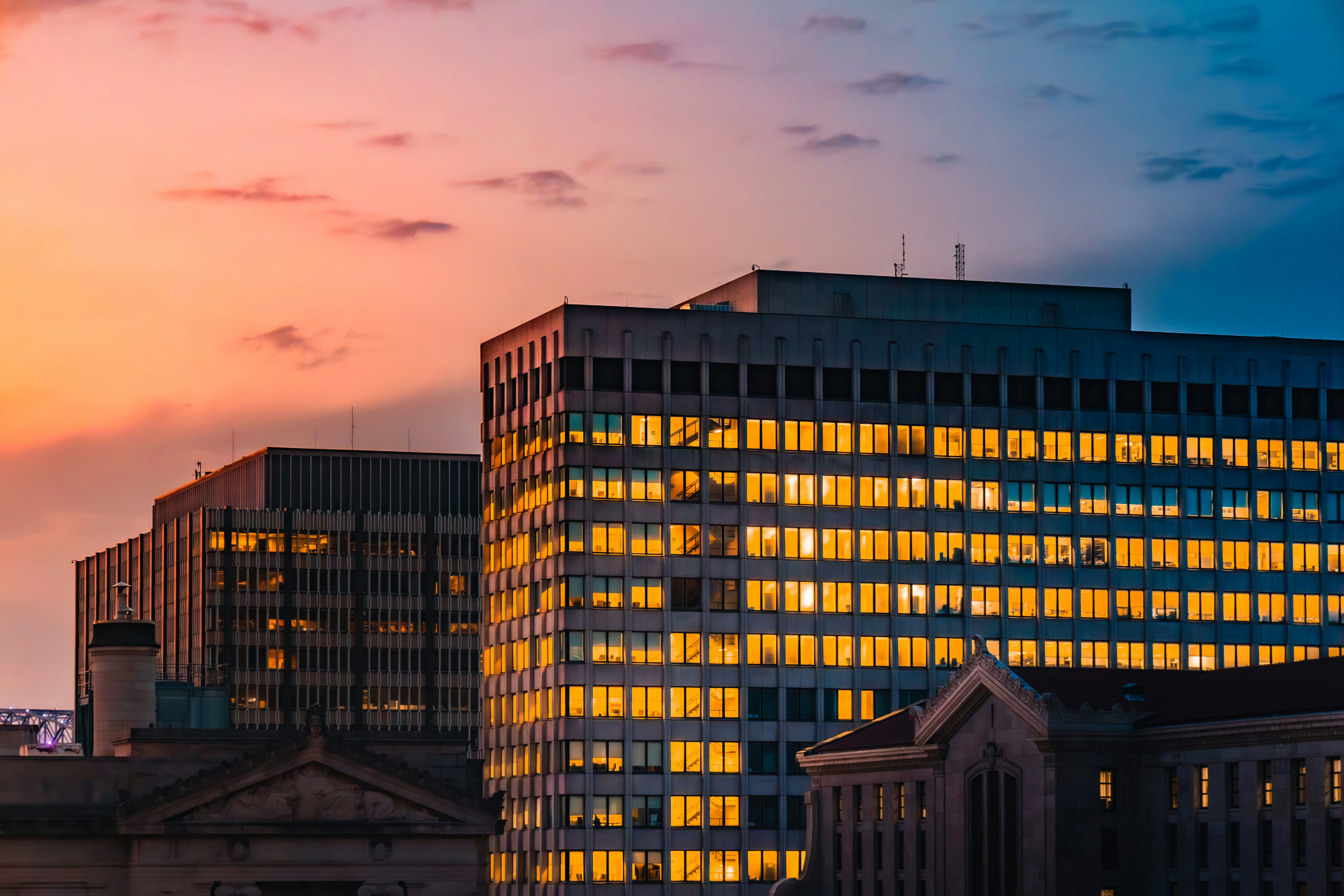 Dusk in the Glass Grid: Warm Windows Paint the Skyline