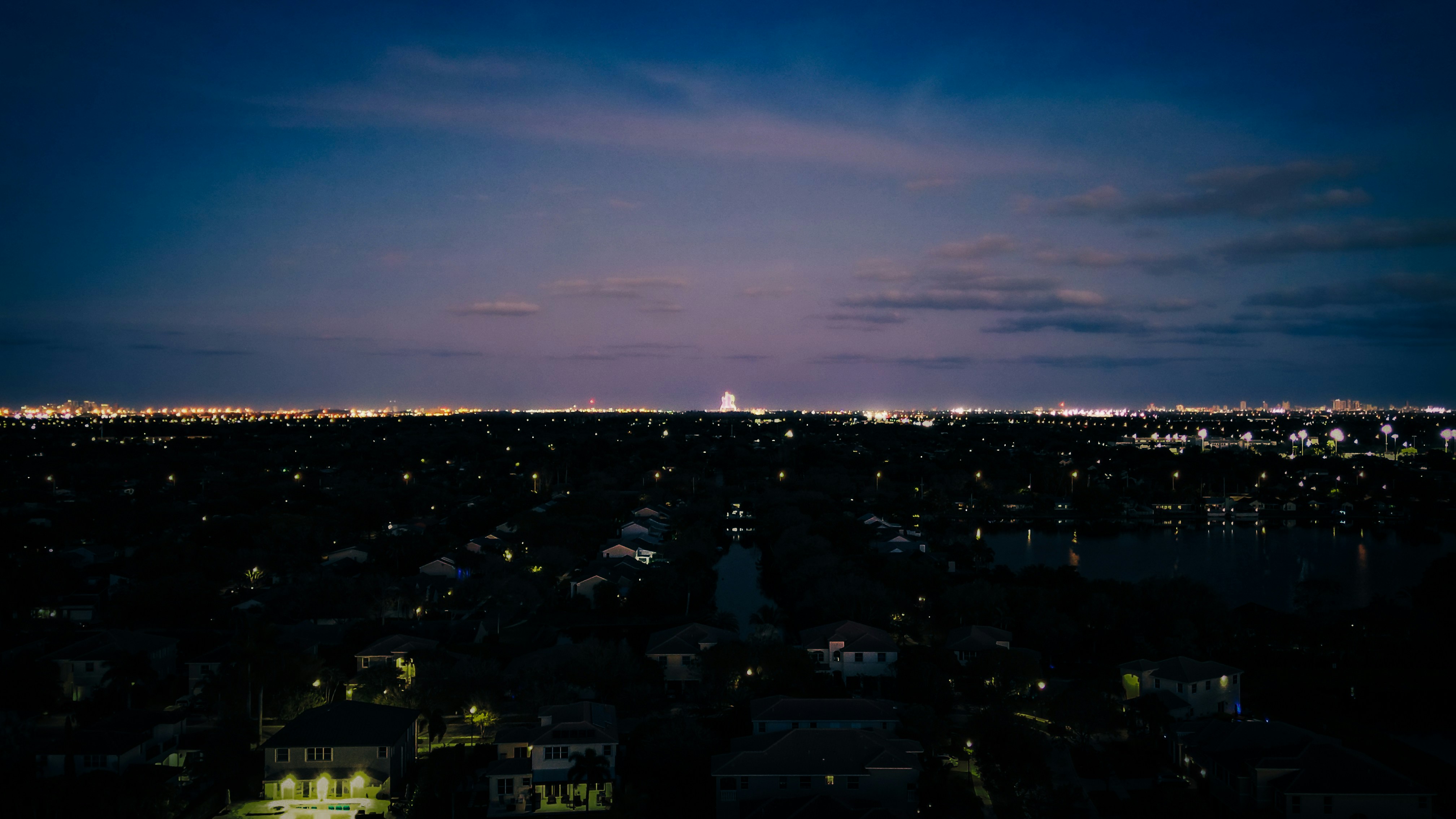 Horizon Glow Over a Sleeping Suburb at Blue Hour
