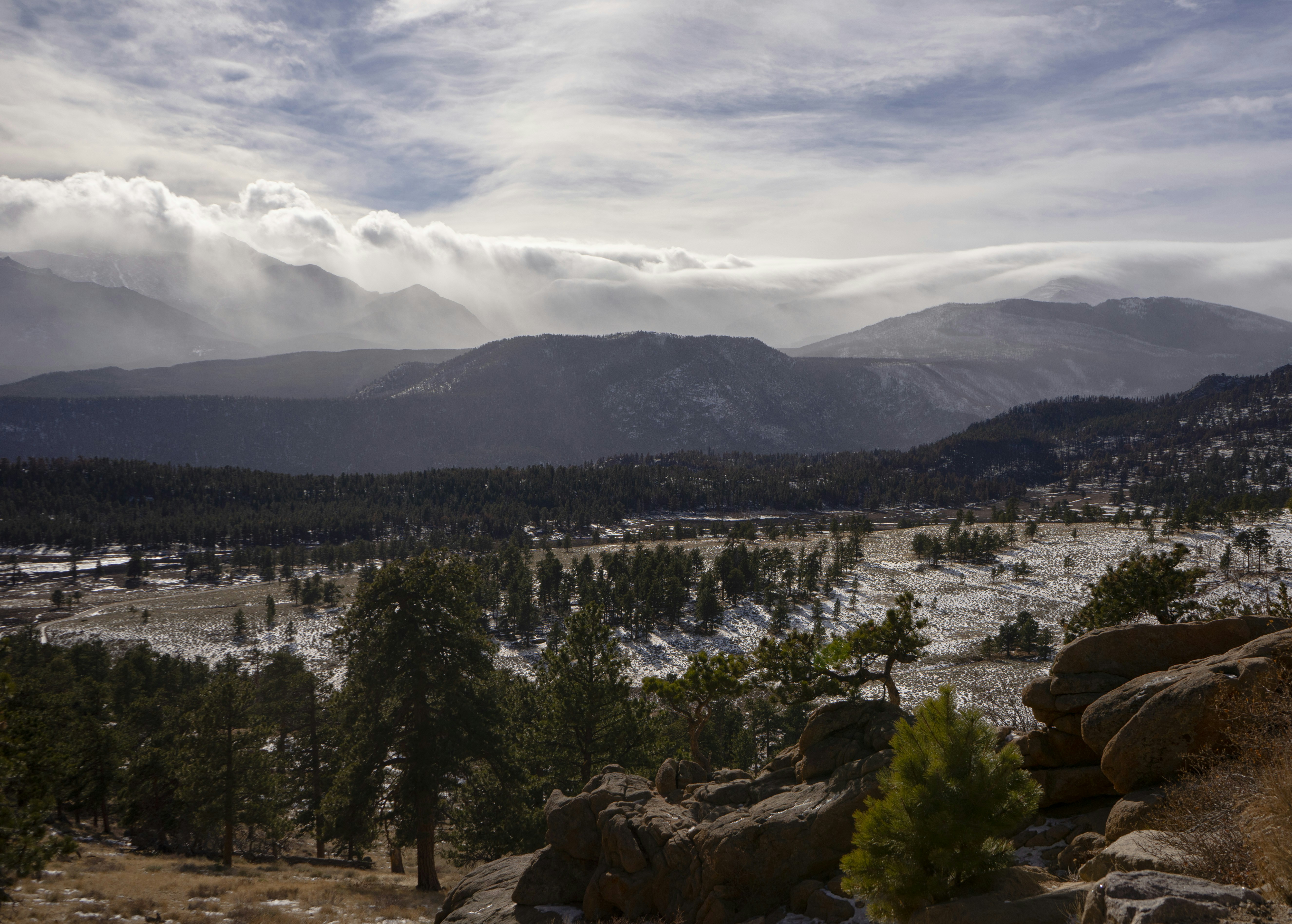 Granite Rim Panorama: Snow-Pine Canvas Beneath an Open Sky