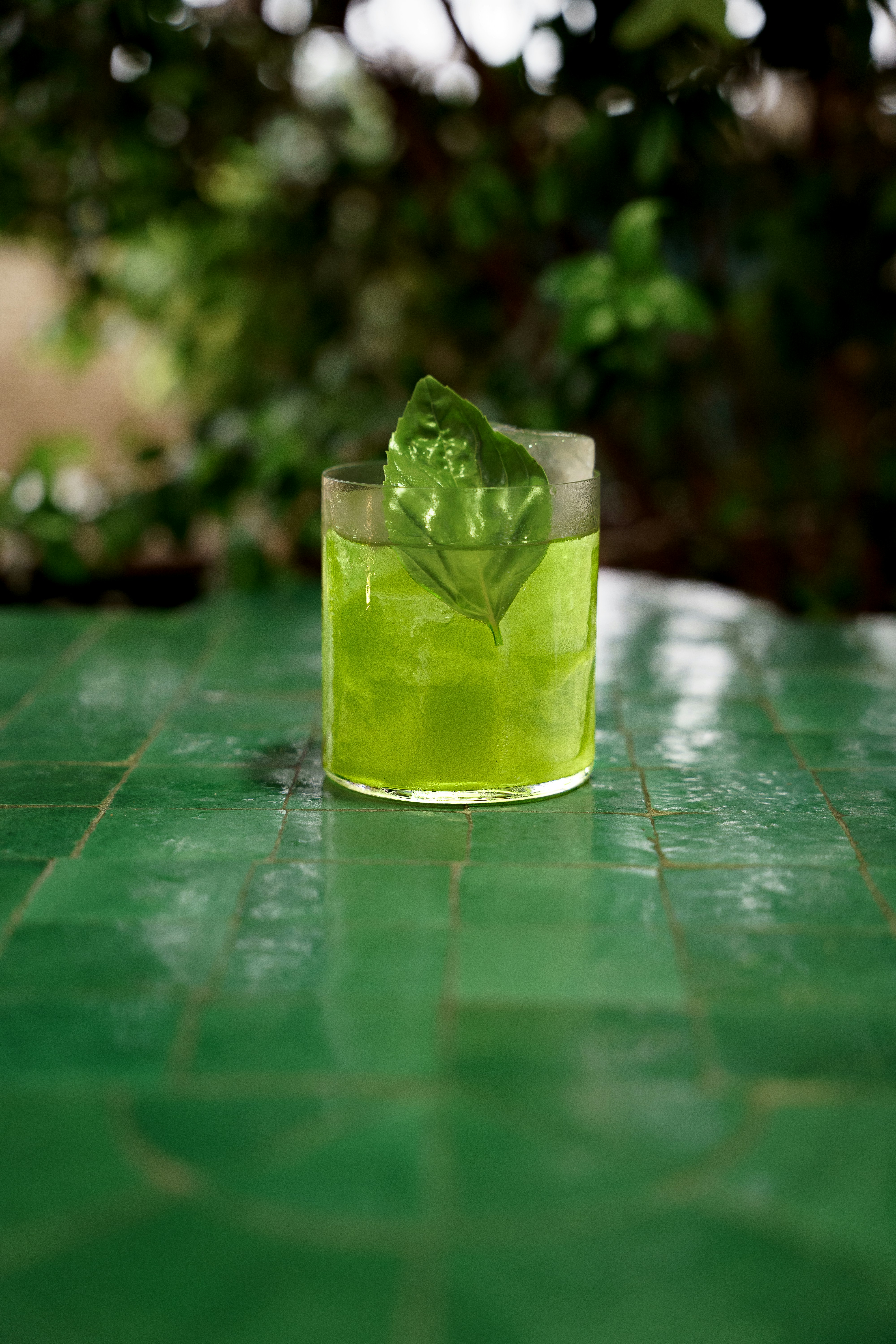 Emerald Glass: Basil Leaf in a Lime-Hued Cocktail
