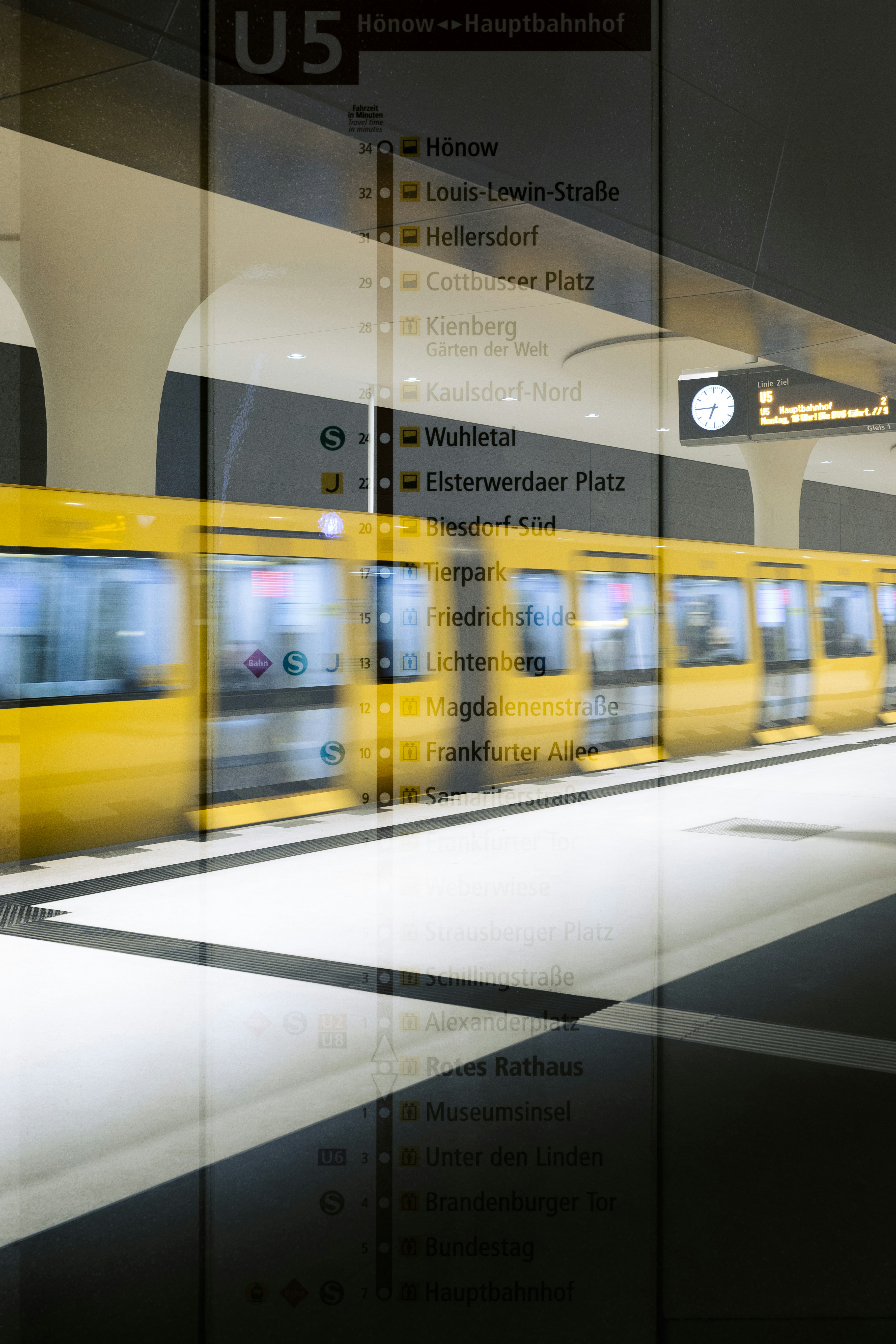 A yellow train traveling through a train station photo – Free Travel ...