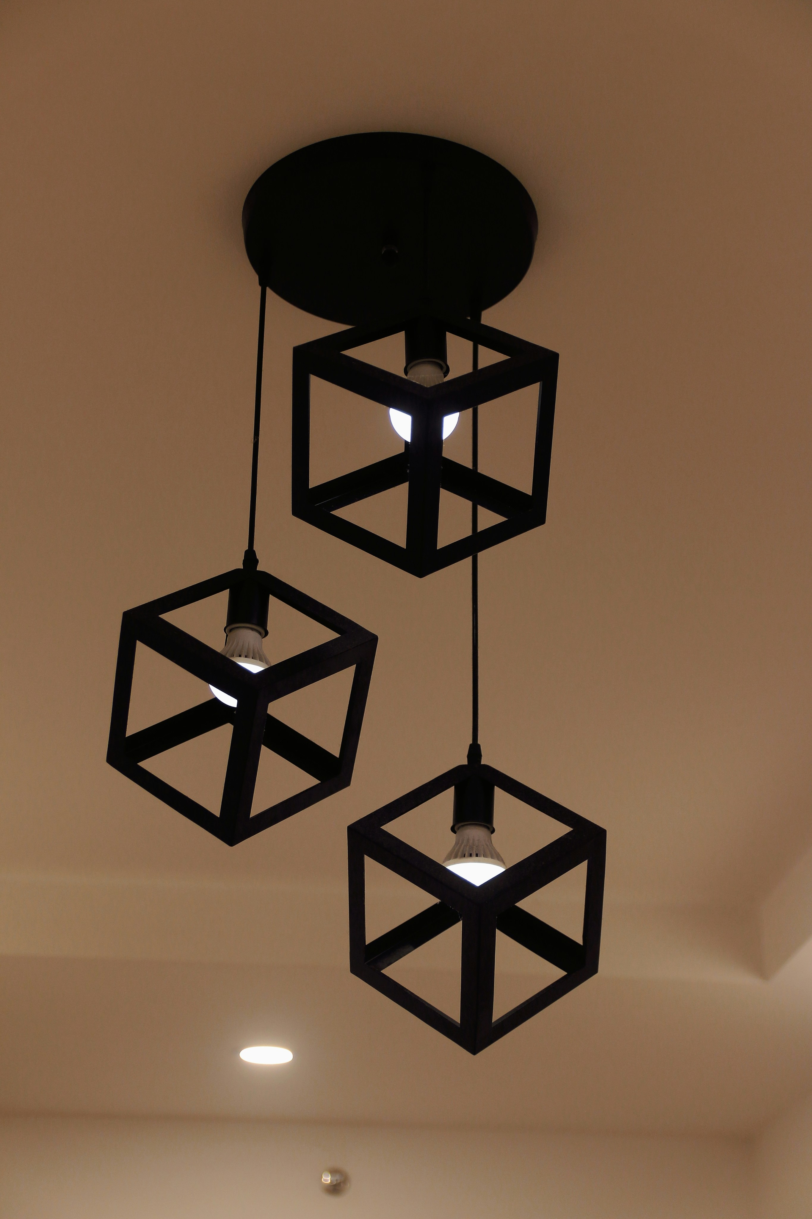 A couple of lights that are hanging from a ceiling photo – Free Black ...