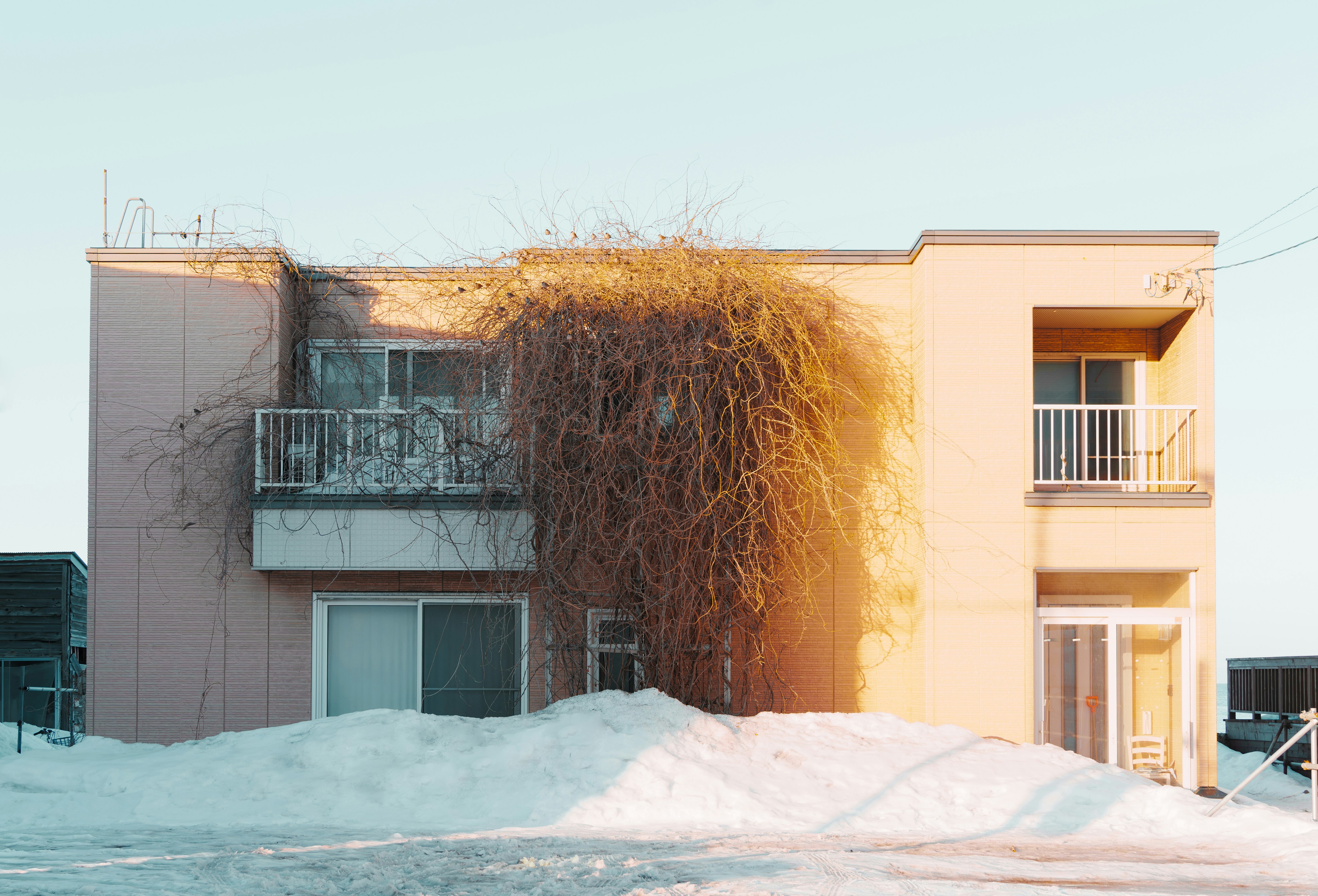 A building with a bunch of snow on the ground photo – Free Zenibako ...