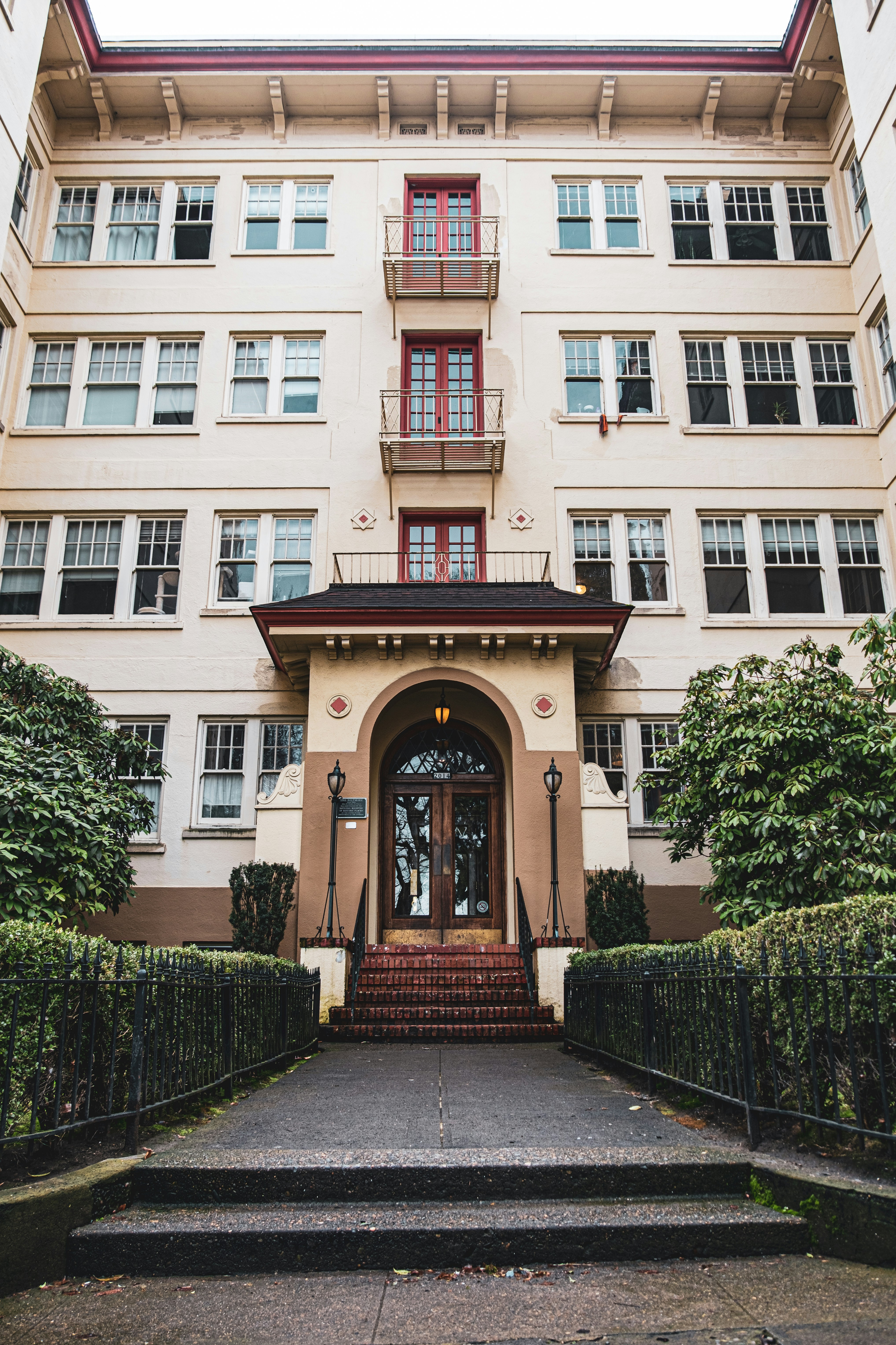 a large building with many windows and stairs leading up to it