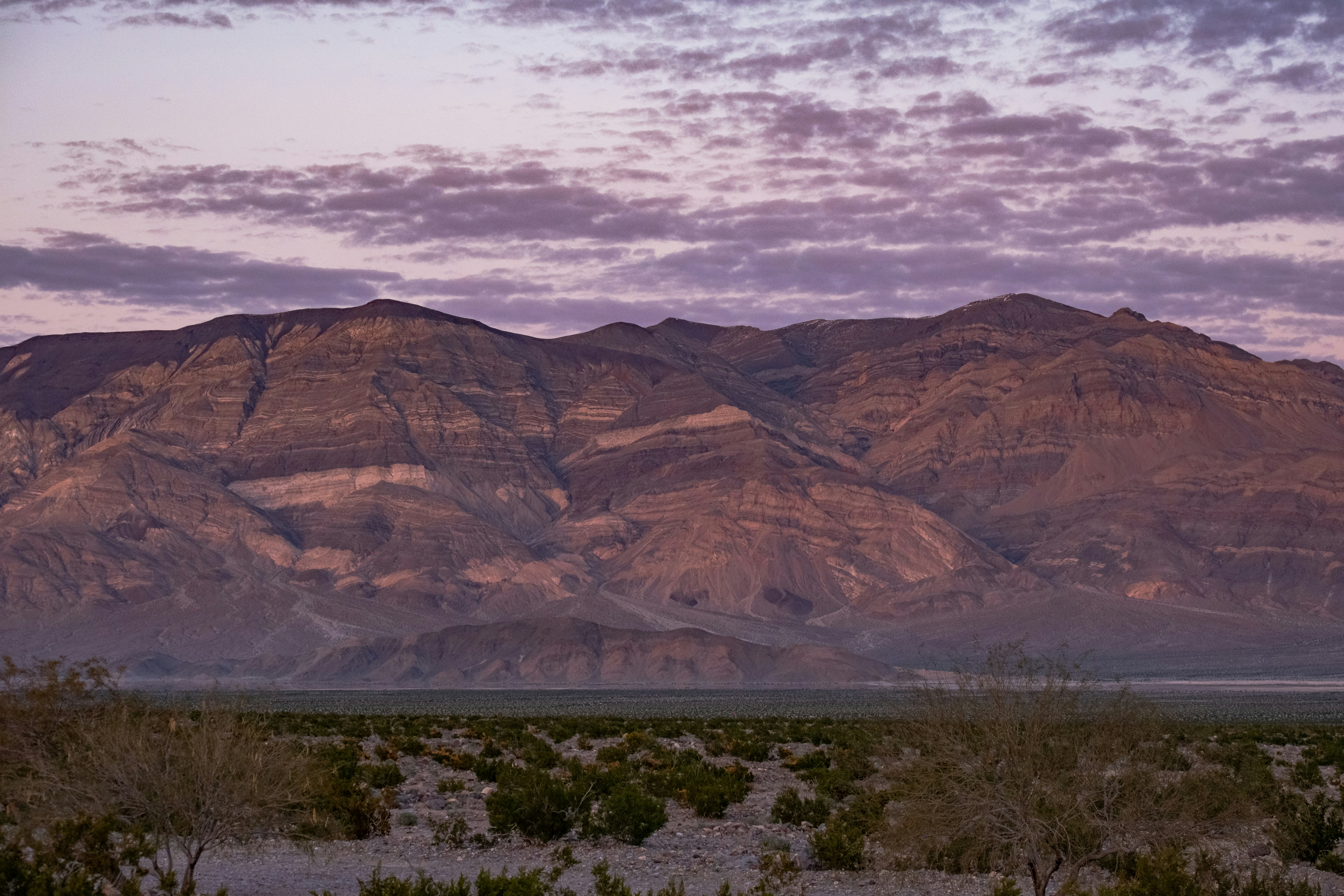 Dusk over Desert Ridge: Pastel Strata Across the Basin