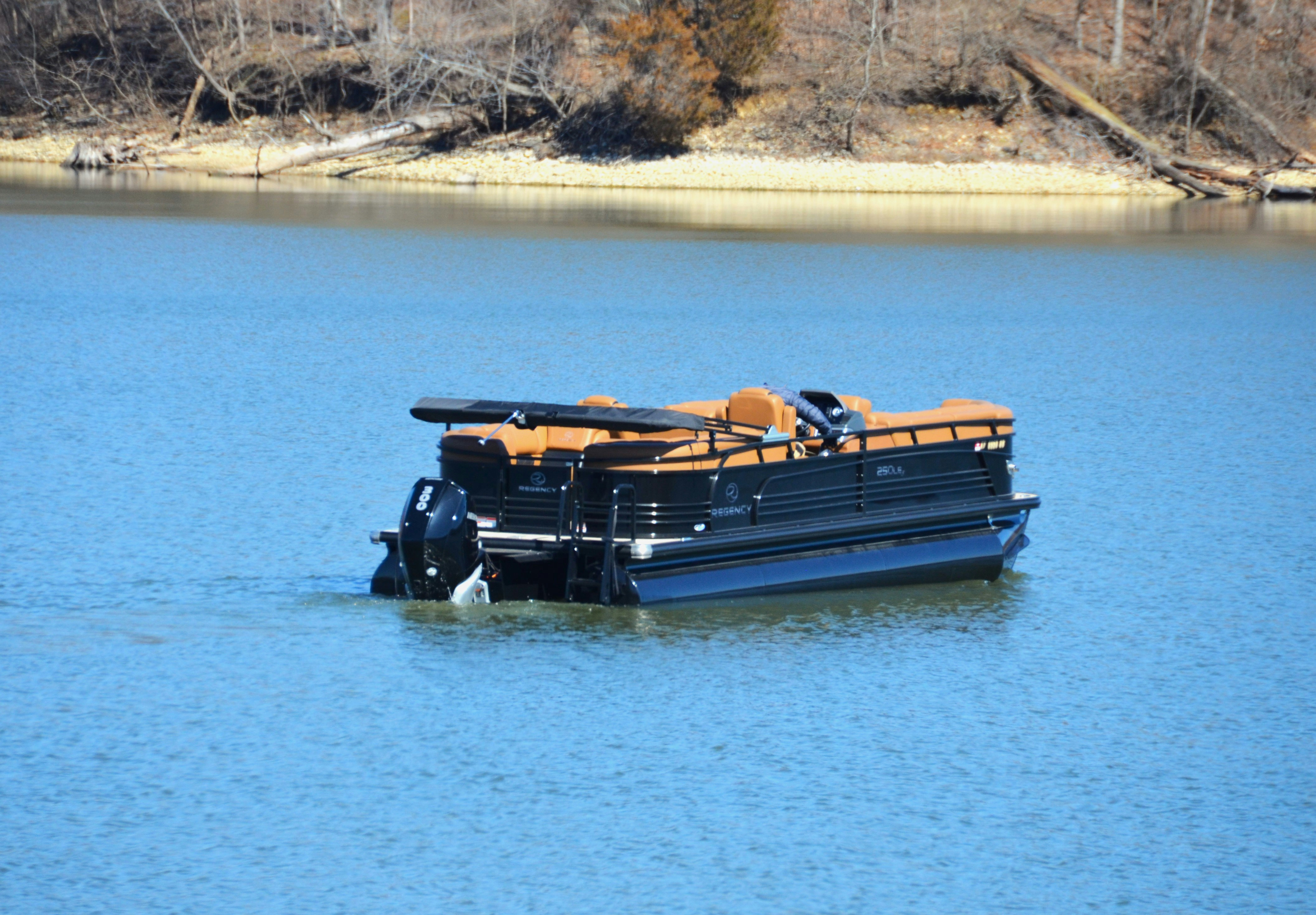 A large boat floating on top of a lake photo – Free Boat Image on Unsplash