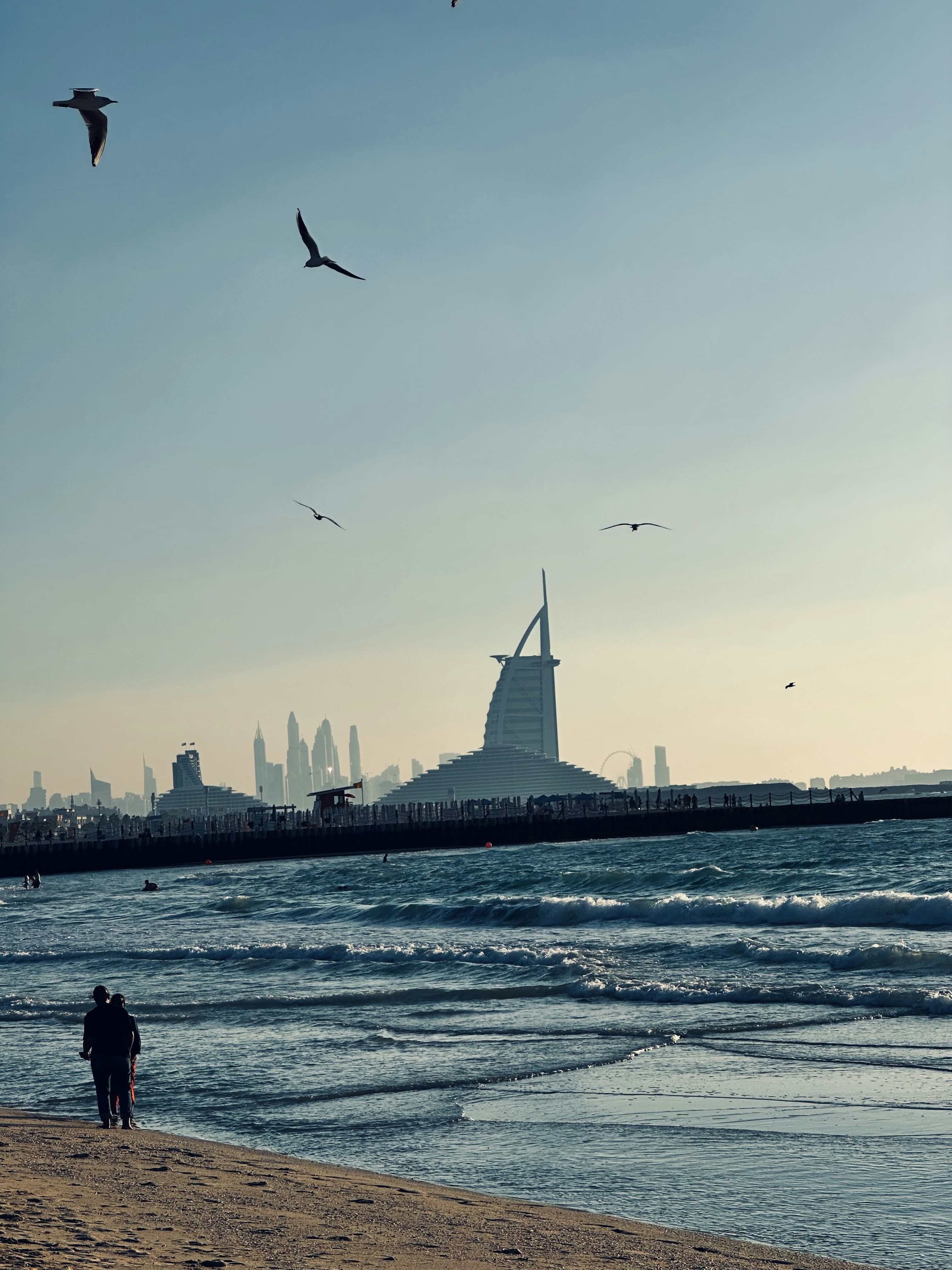 Golden Hour Over Dubai: Burj Al Arab Silhouette from a Quiet Beach