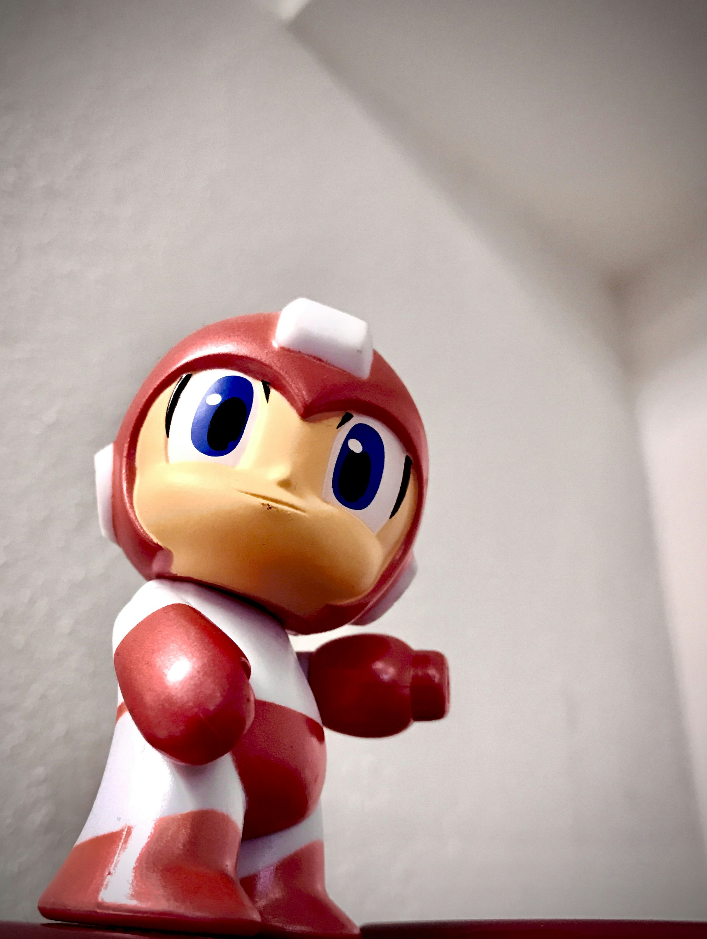 Red-helmeted Goomba: a close-up of a toy figure ready for play