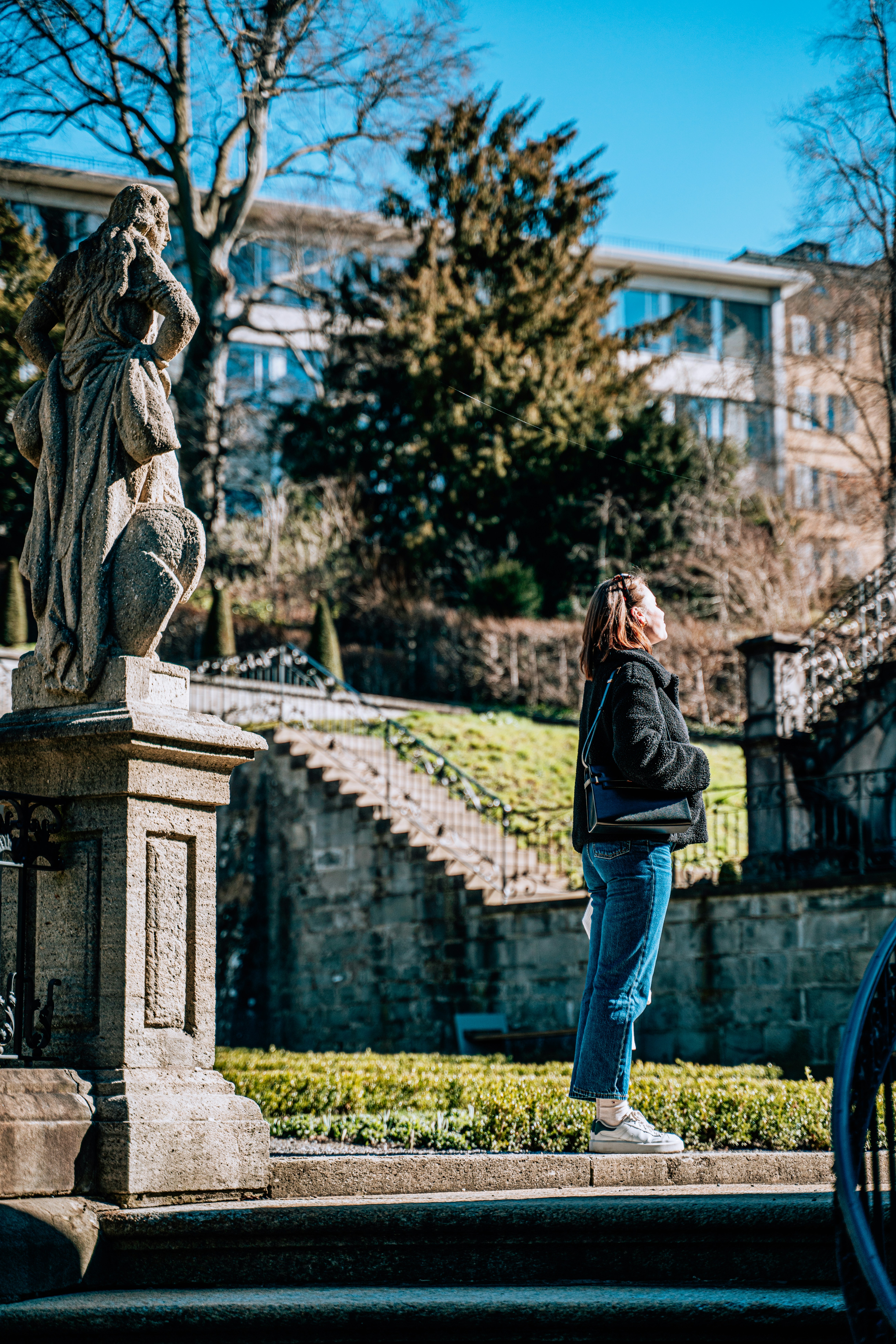 Courtyard Reverie: A Moment Beside the Stone Guardian