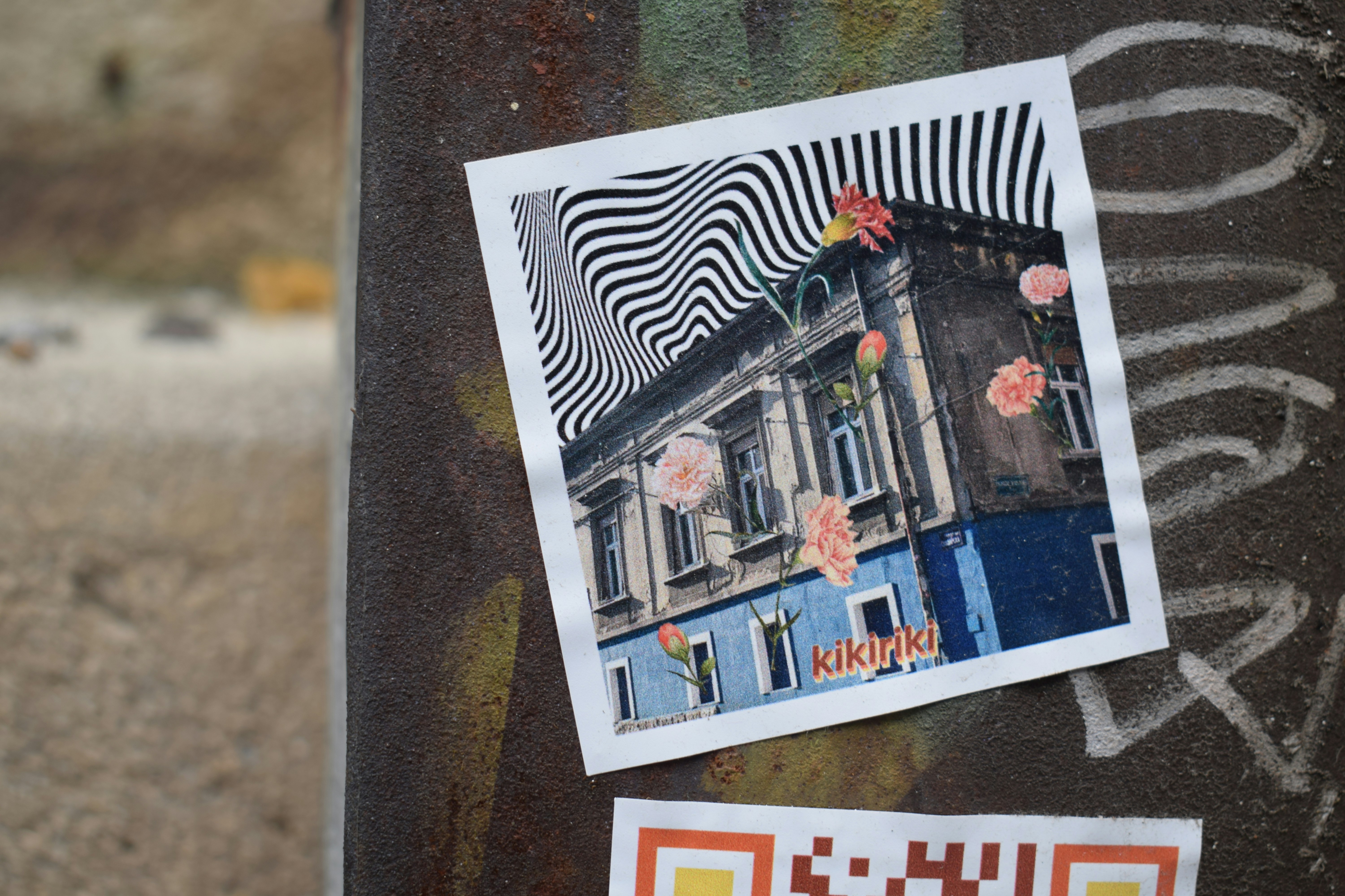 Stickered Facade: A Floating Polaroid of Urban Texture
