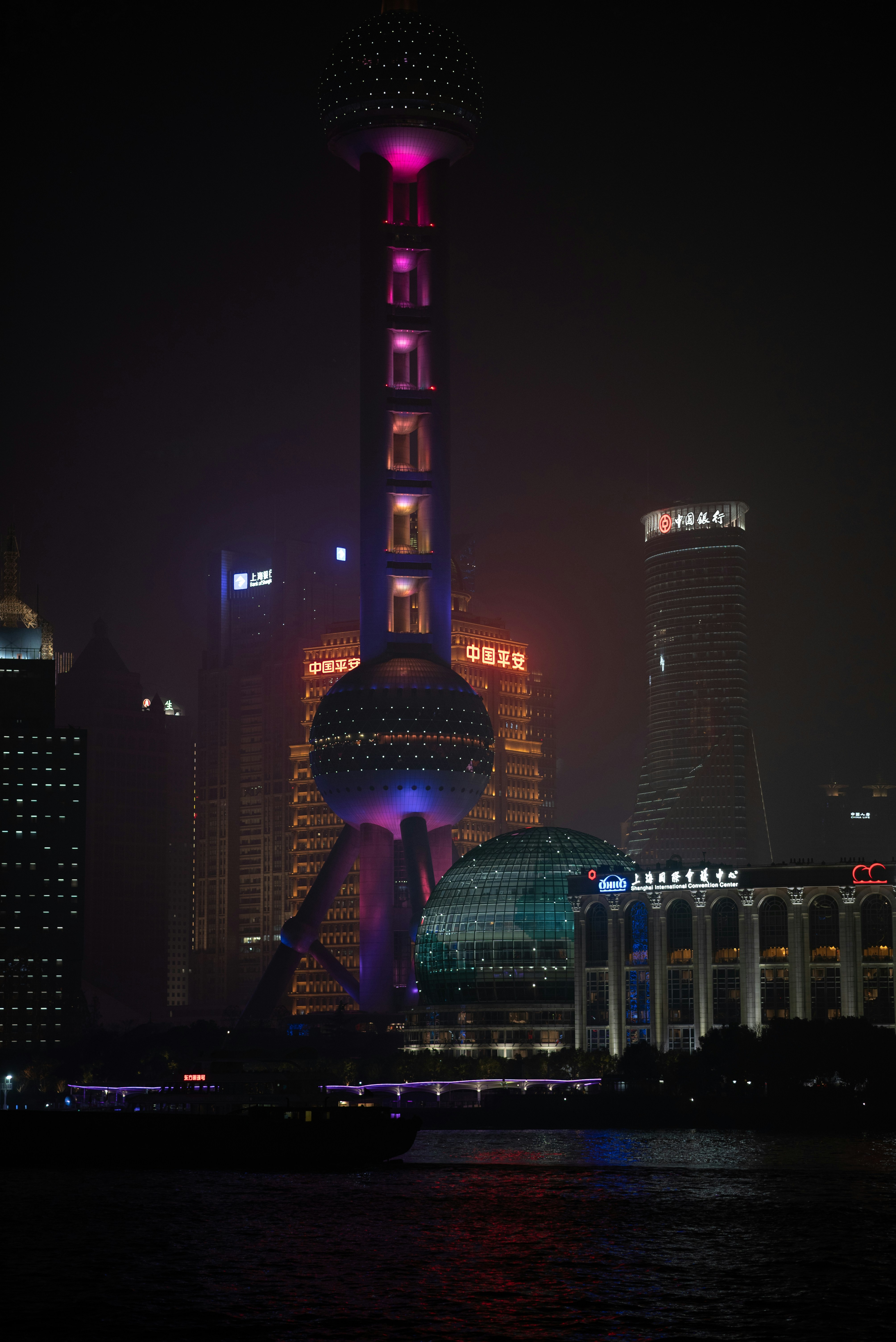 A very tall building with a lot of lights on it photo – Free Building ...