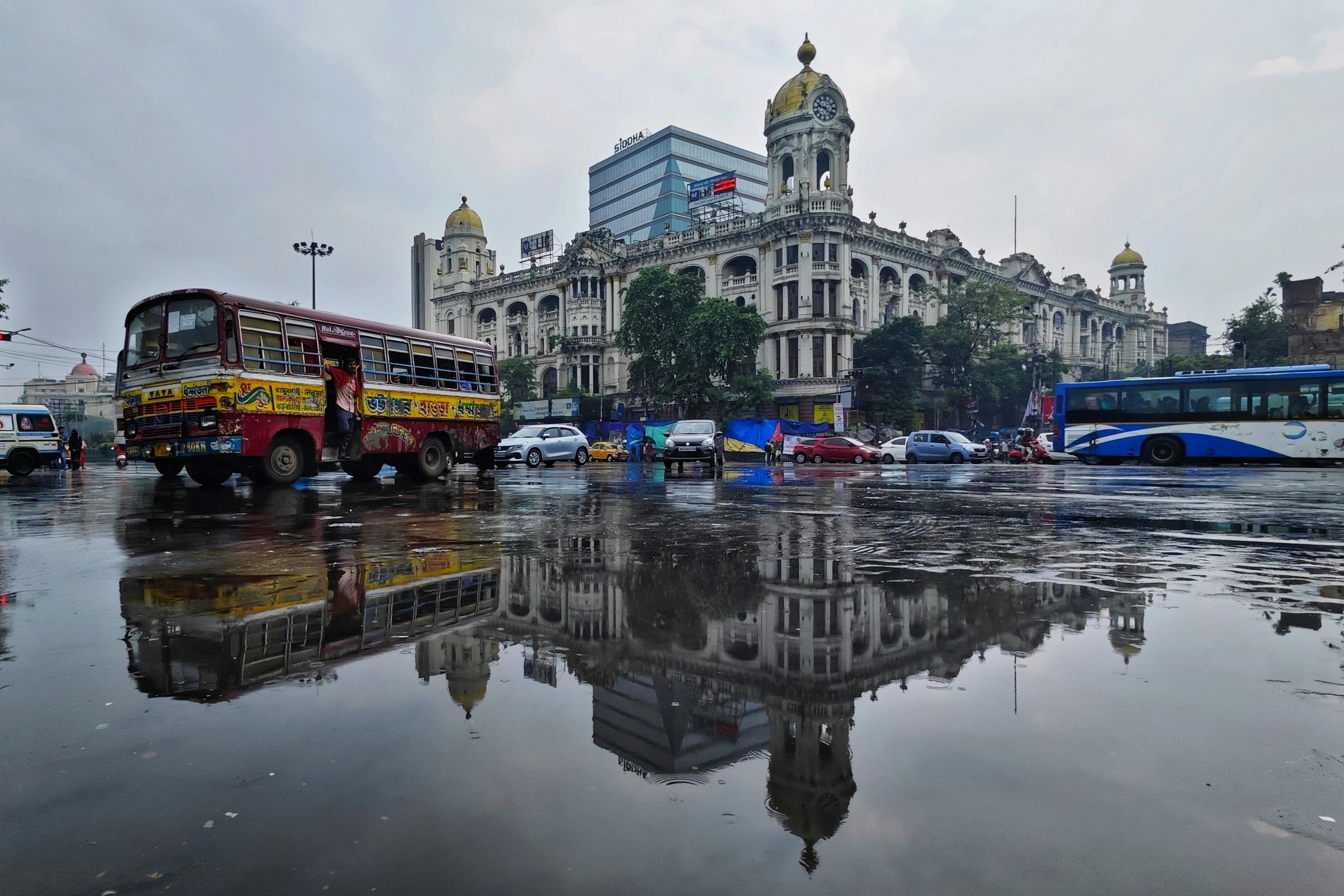 Reflections in a Rainy City Square