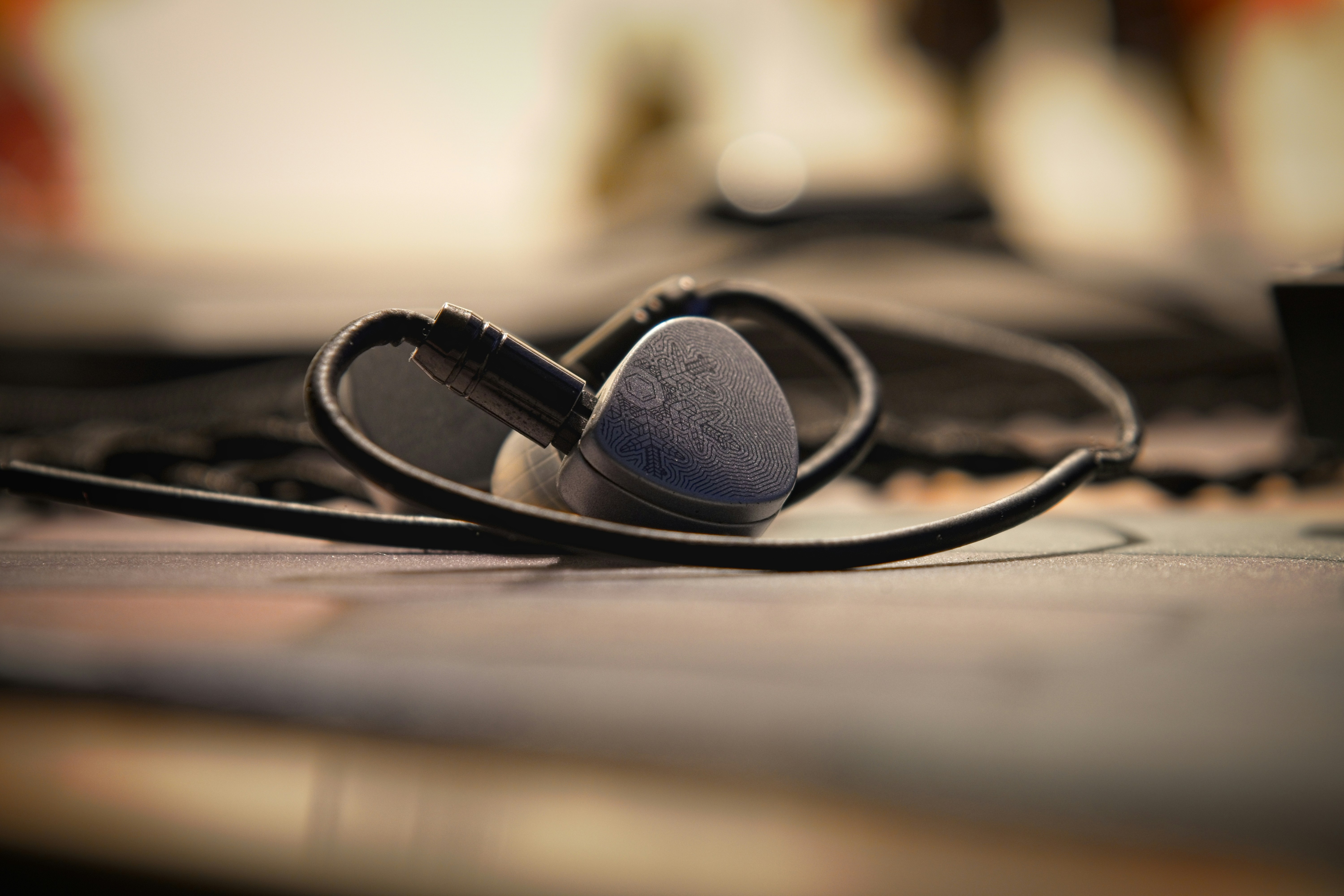A pair of ear buds sitting on top of a table photo – Free Headphones ...