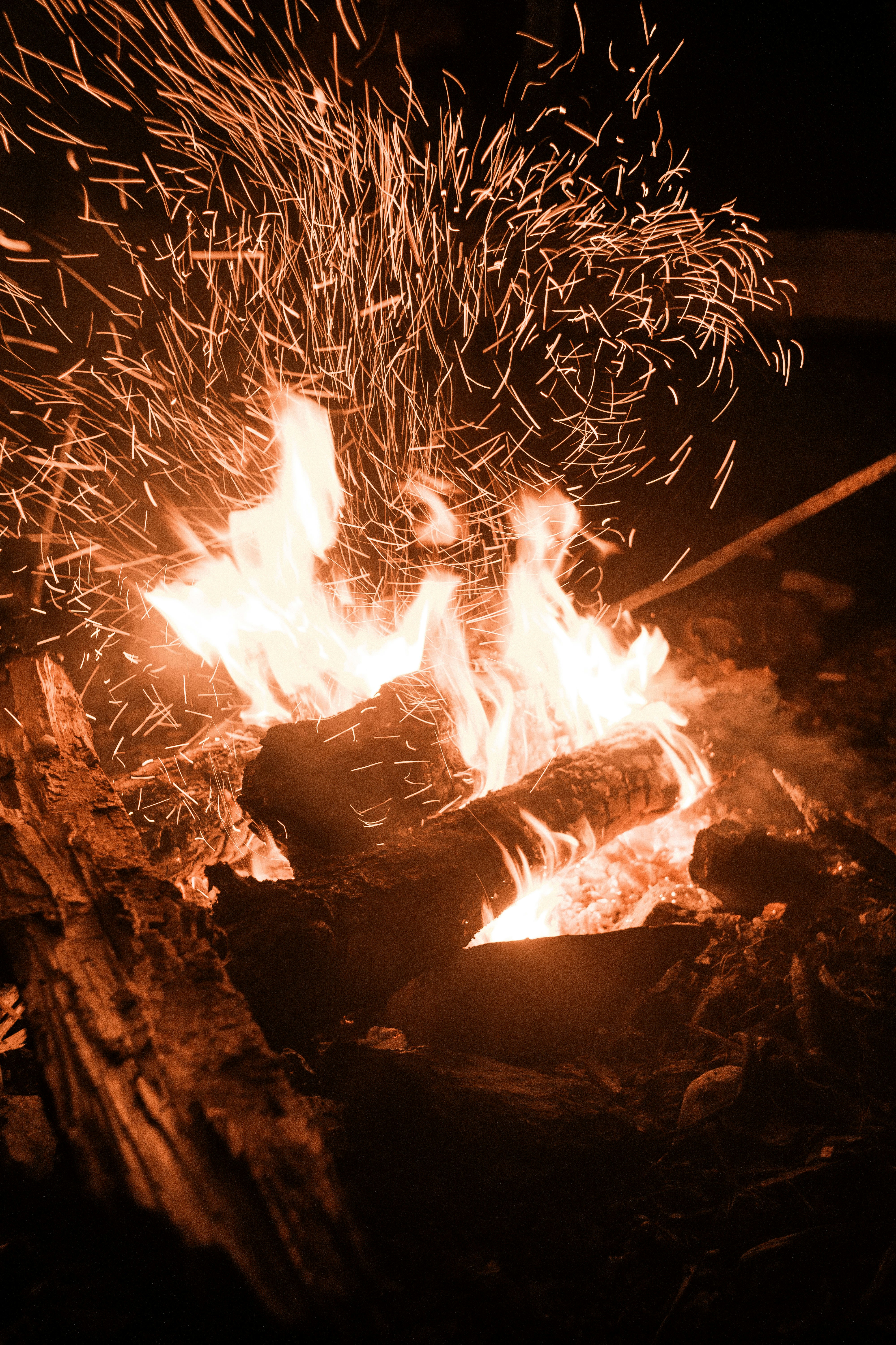 Nocturnal Ember Cascade: Firelight and Flying Sparks