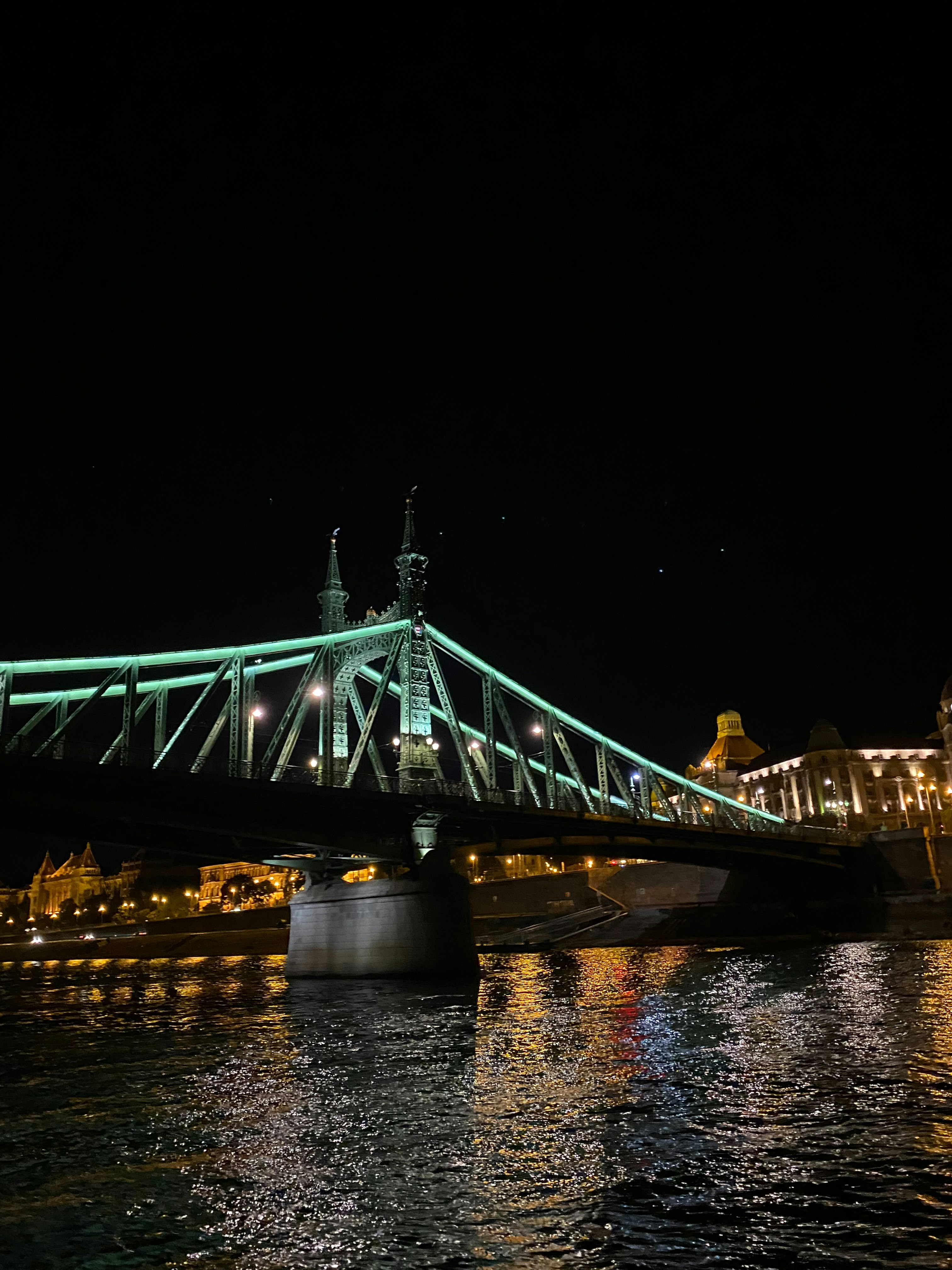 Emerald Arc Over Stillwater: Night-lit Truss Bridge