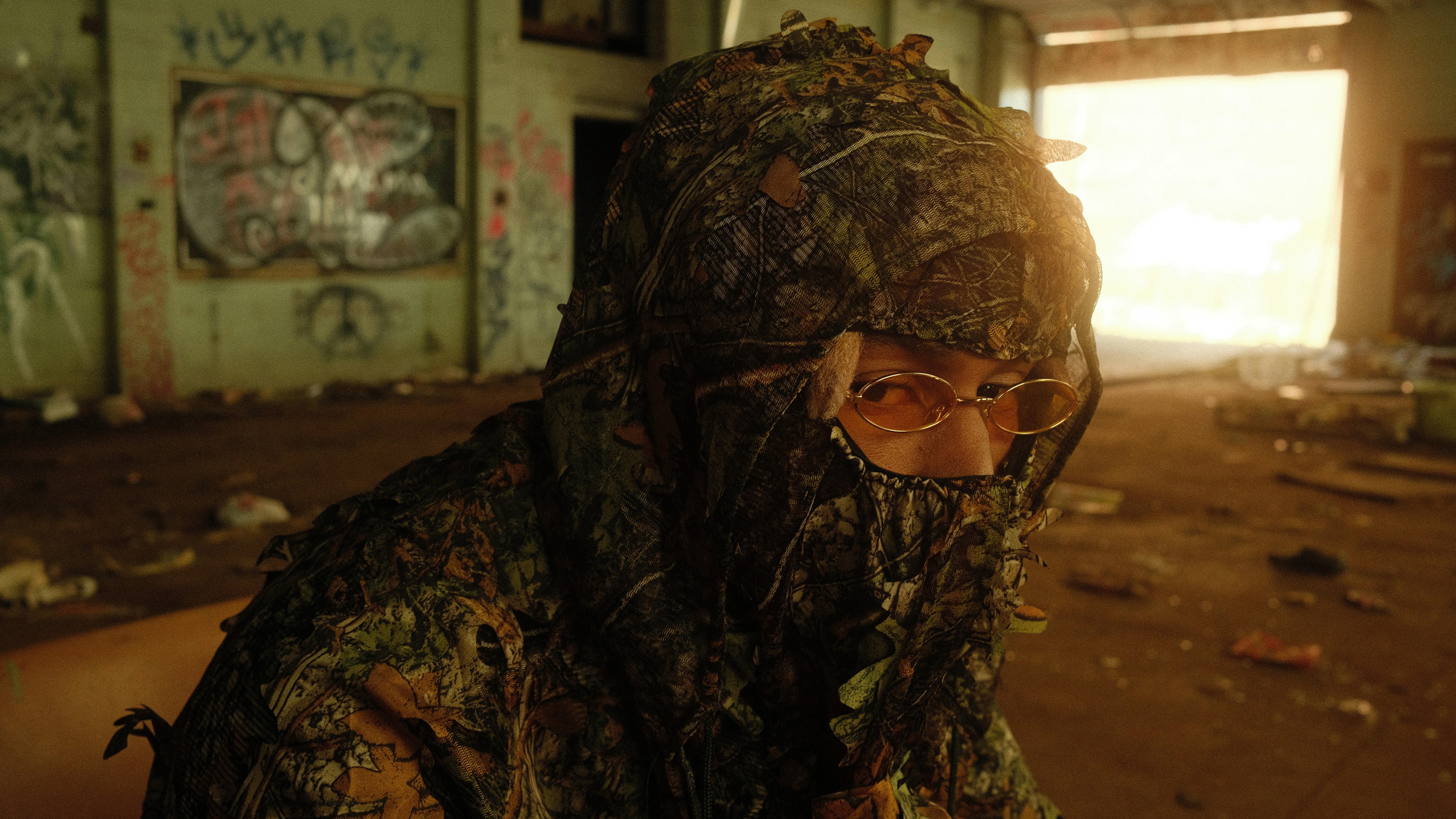 Ghillie-Clad Gaze in a Graffiti-Soaked Ruin
