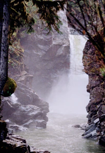Cascade Between Granite: Veil of Mist in a Narrow Gorge