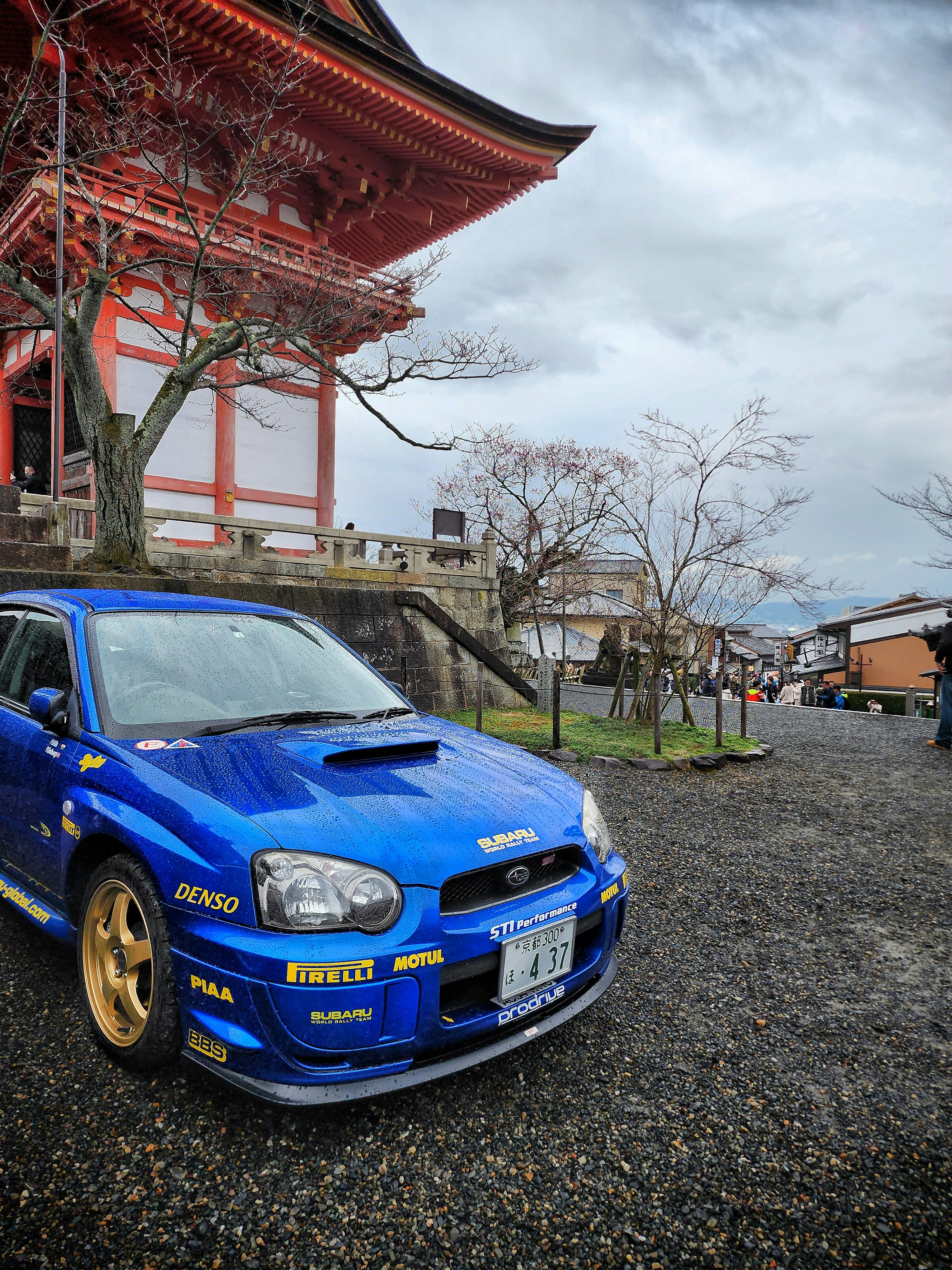 Blue Subaru Rally Car Beside the Red Shrine Gate