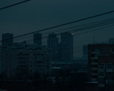 Electric Veins Over a Dusk-Blue Skyline