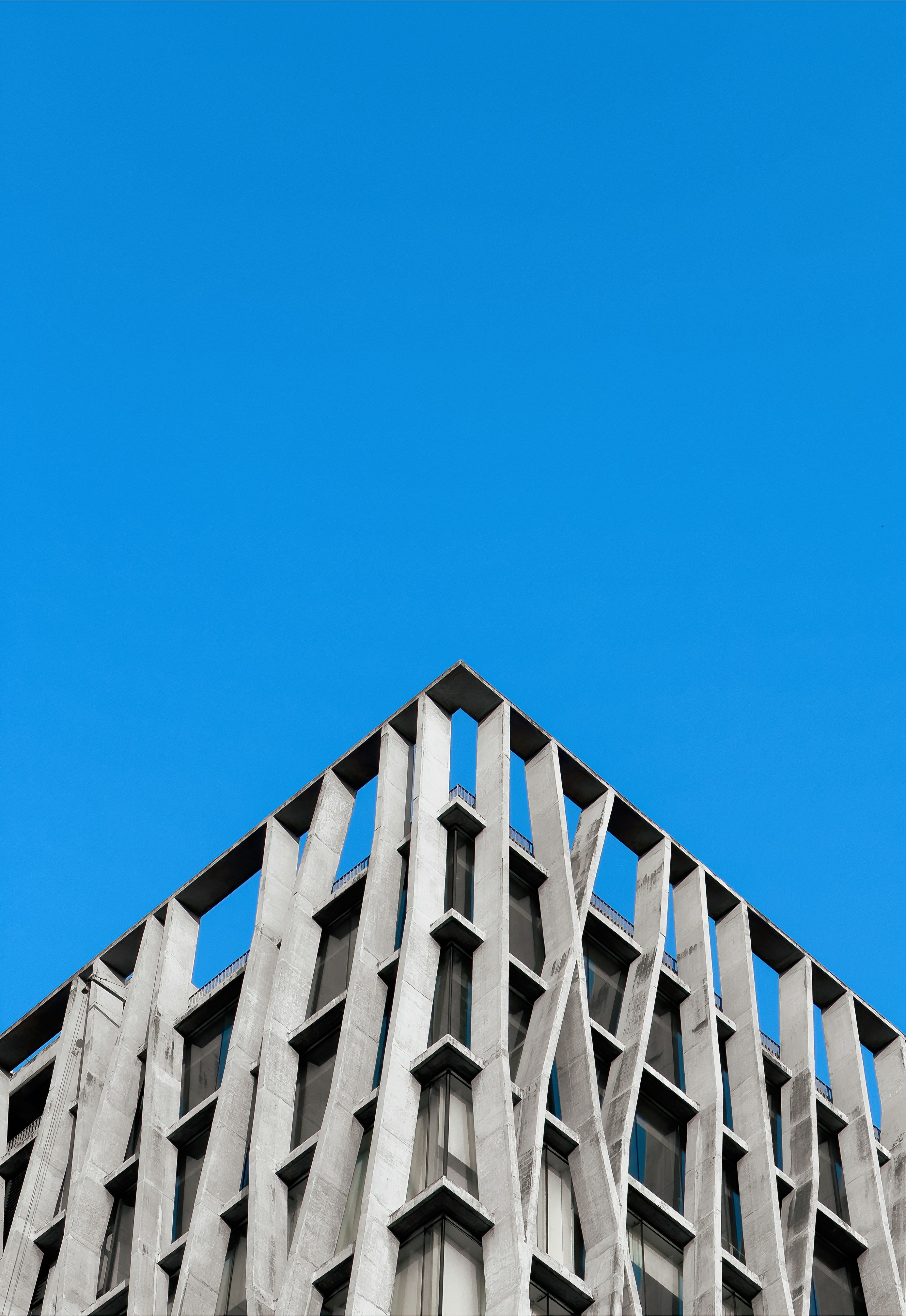 A building made of concrete blocks with a blue sky in the background ...