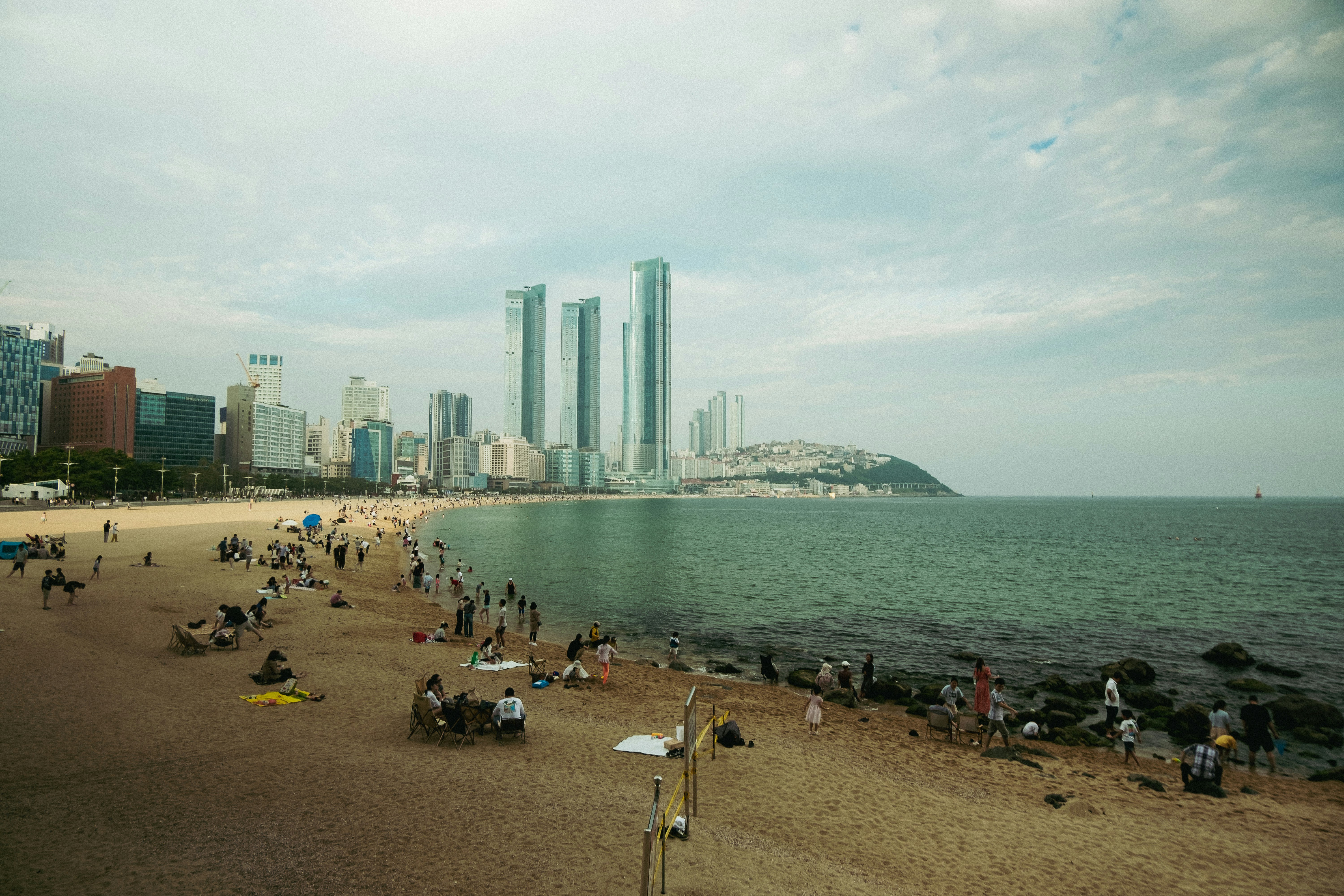 Glass Towers by the Shore: A Busy City Beach Morning