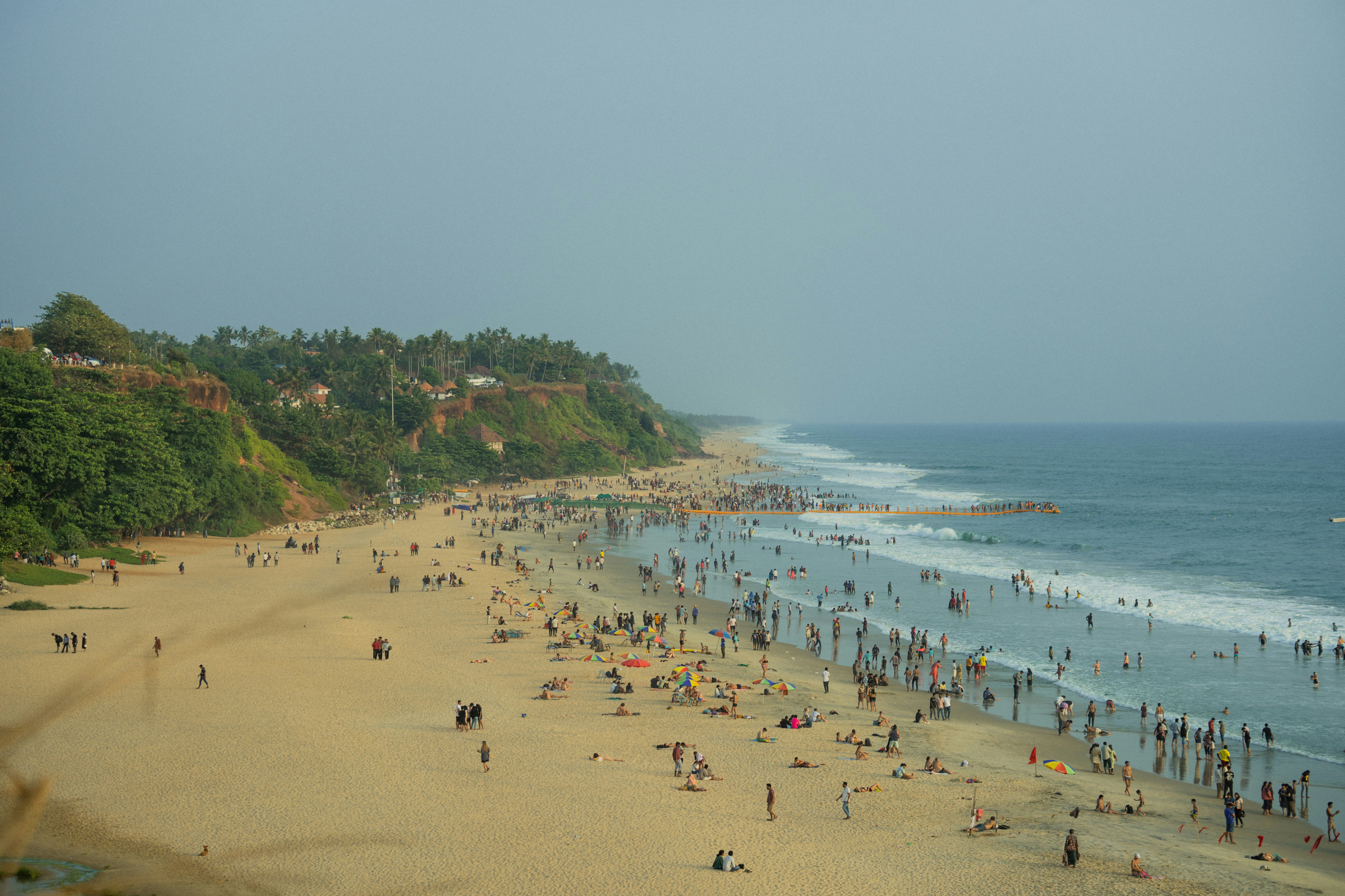 A crowded beach with many people on it photo – Free Nature Image on ...