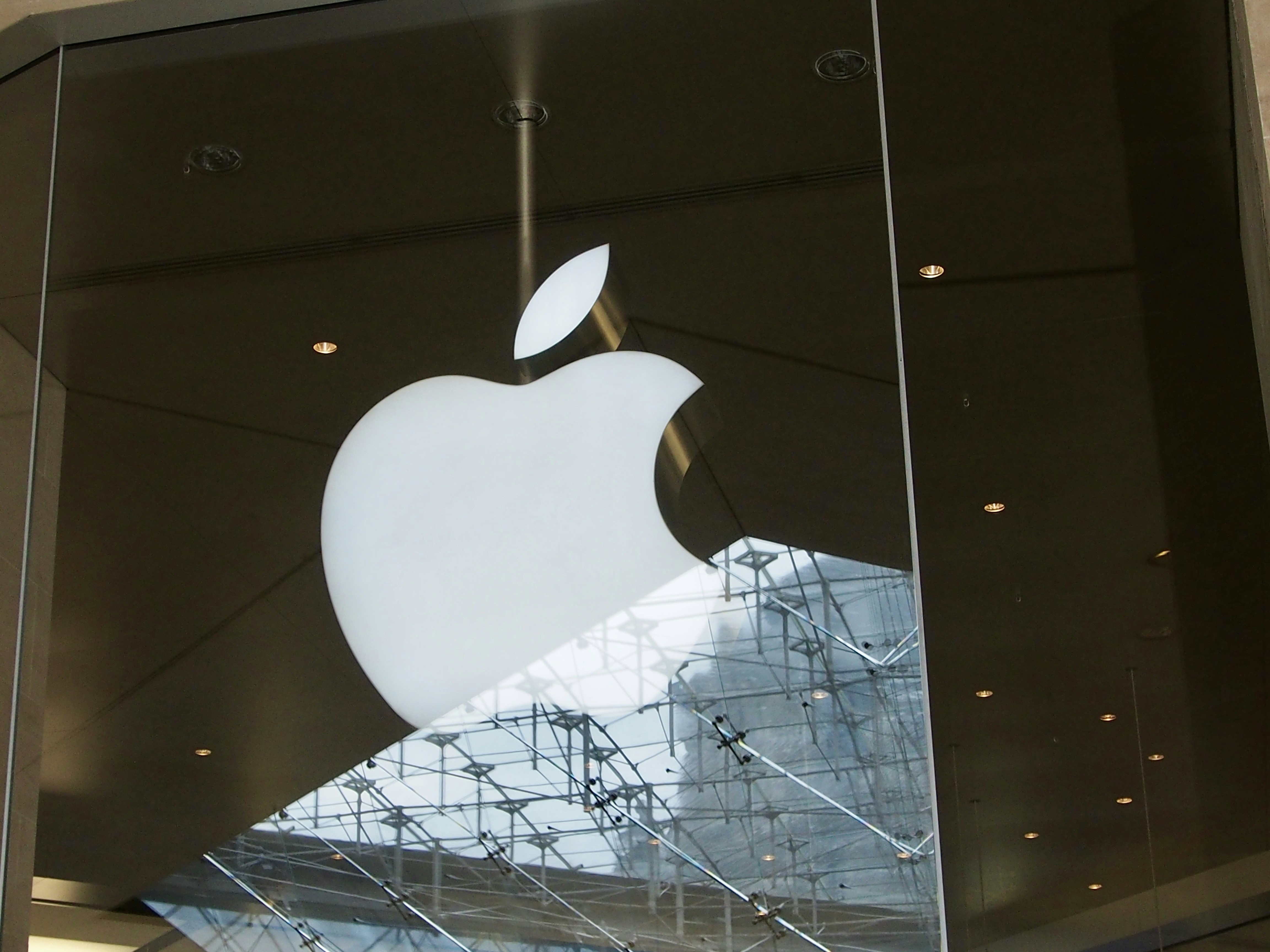 Apple on Glass: Reflections of Steel and Skyline