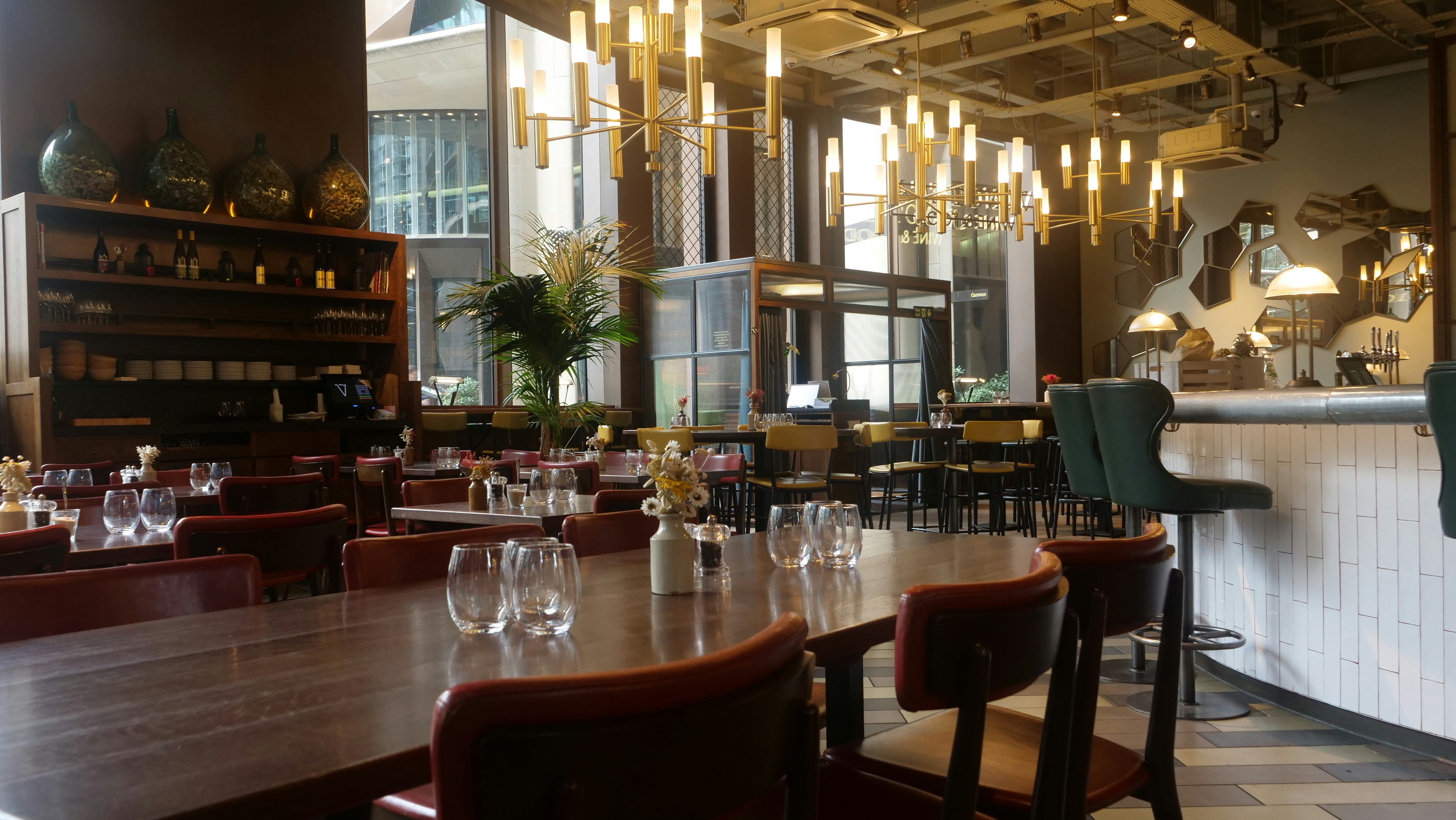 A restaurant with tables, chairs, and a bar photo – Free Uk Image on ...
