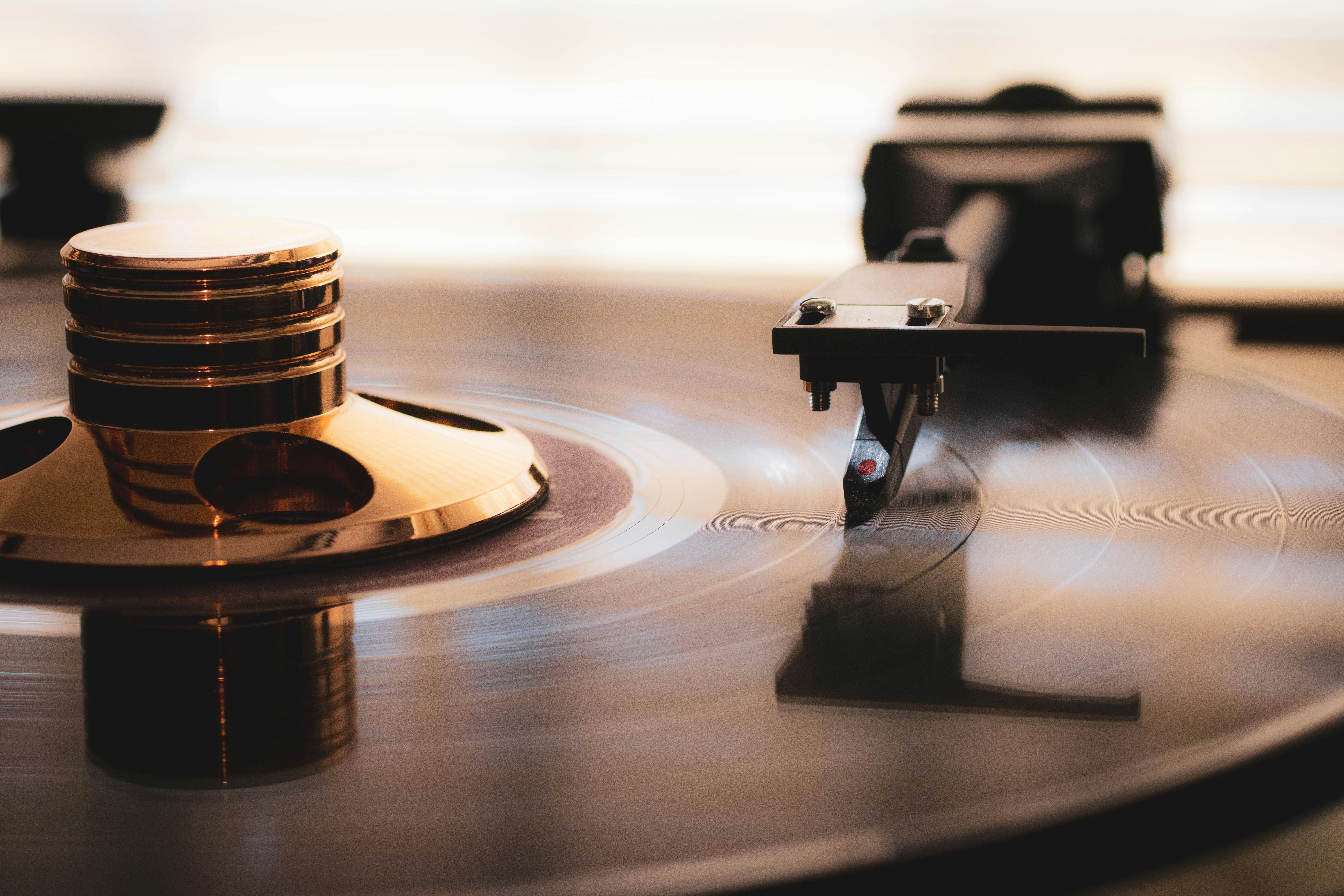 A turntable with a stack of coins on top of it photo – Free Music Image ...