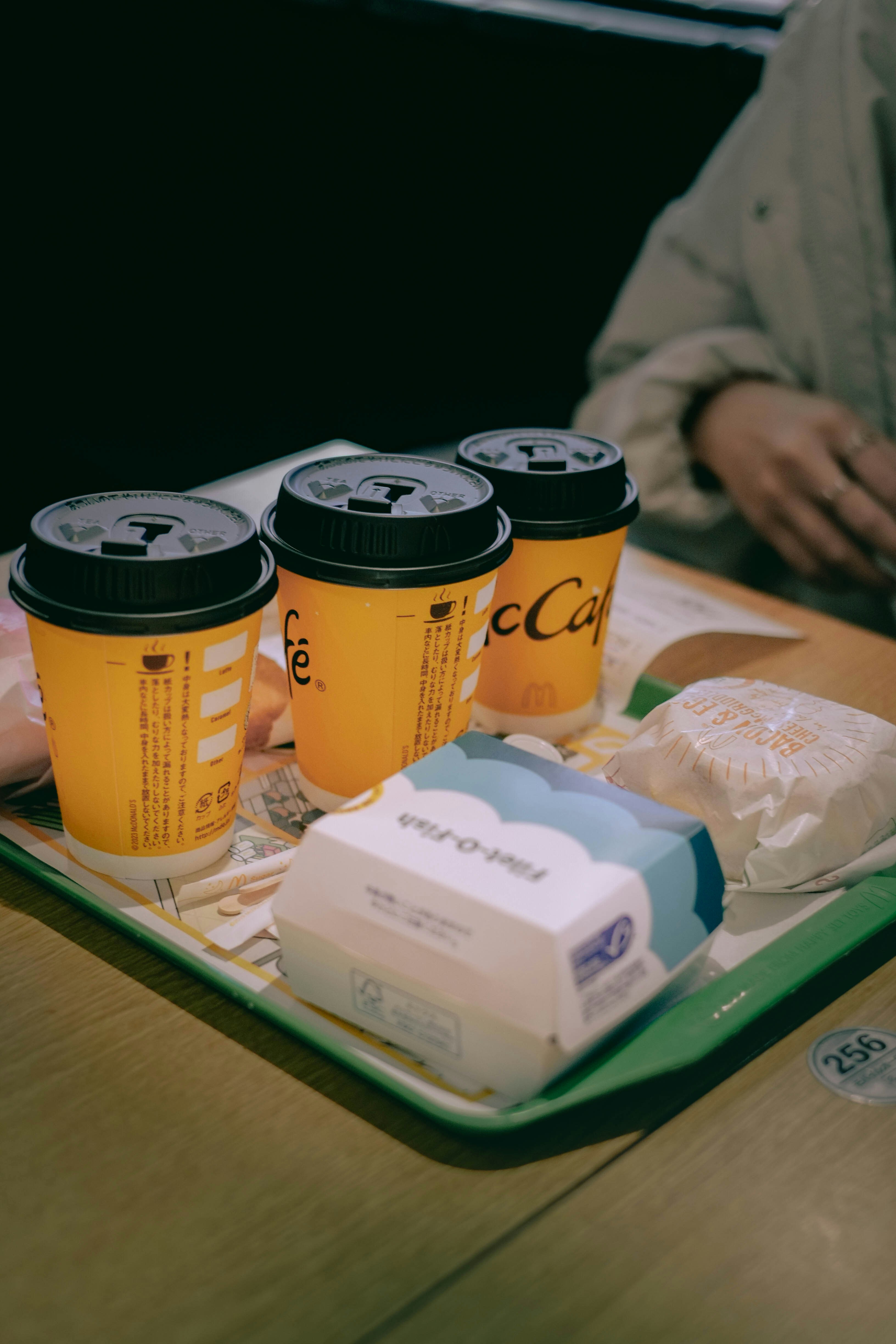 Three Vivid Cups on a Green Café Tray