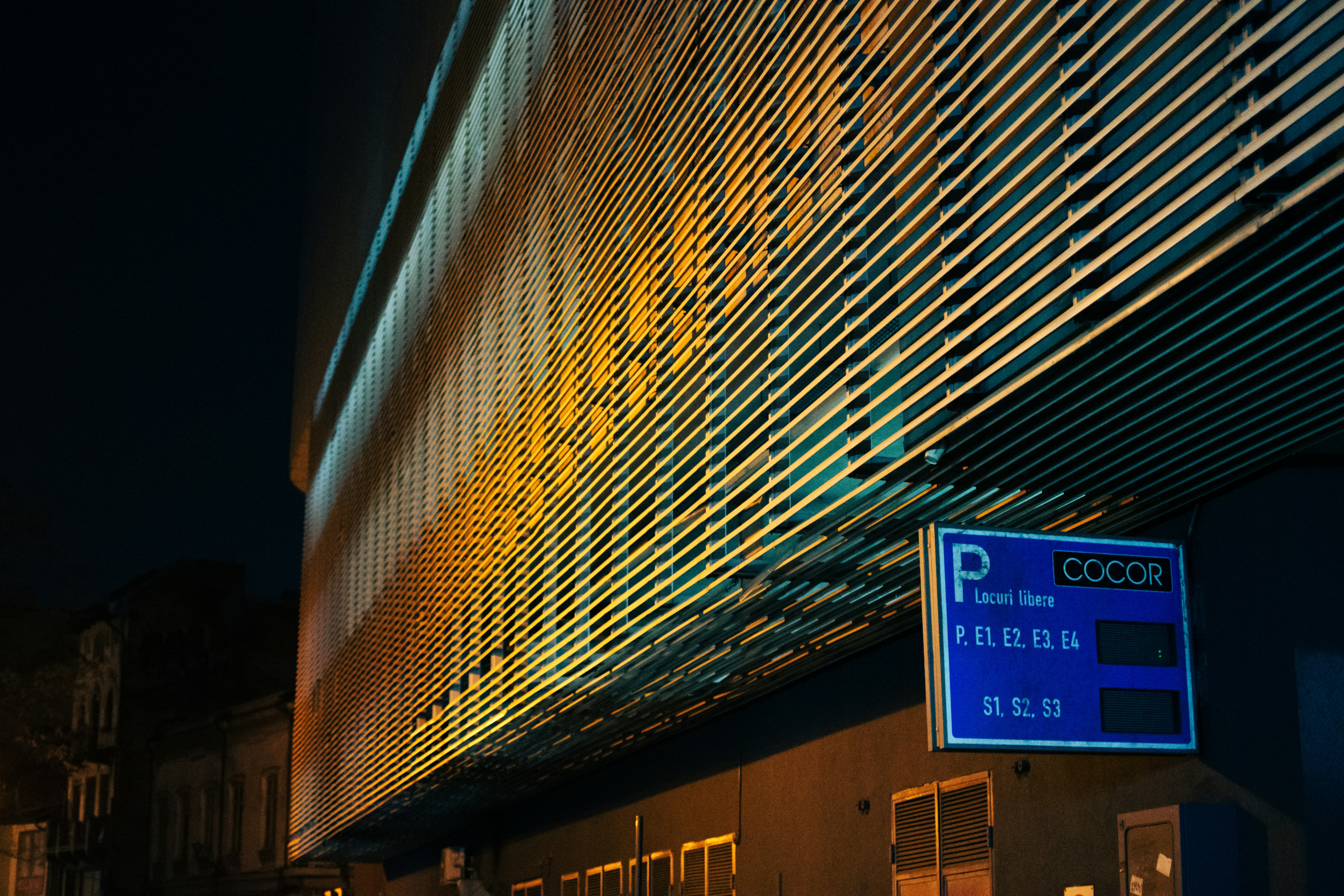 A building that has a sign on the side of it photo – Free Building ...