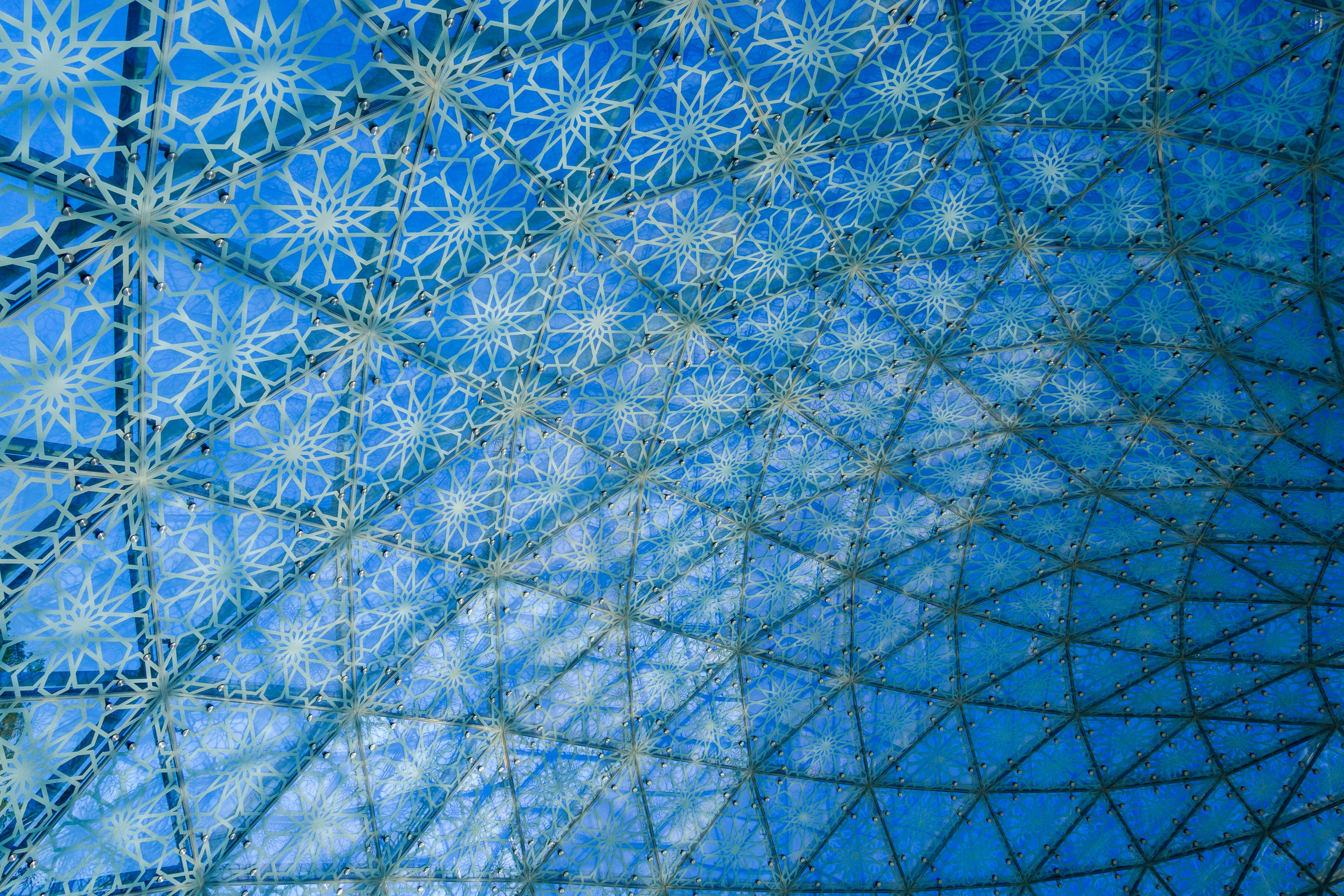 a close up of a structure with a blue sky in the background