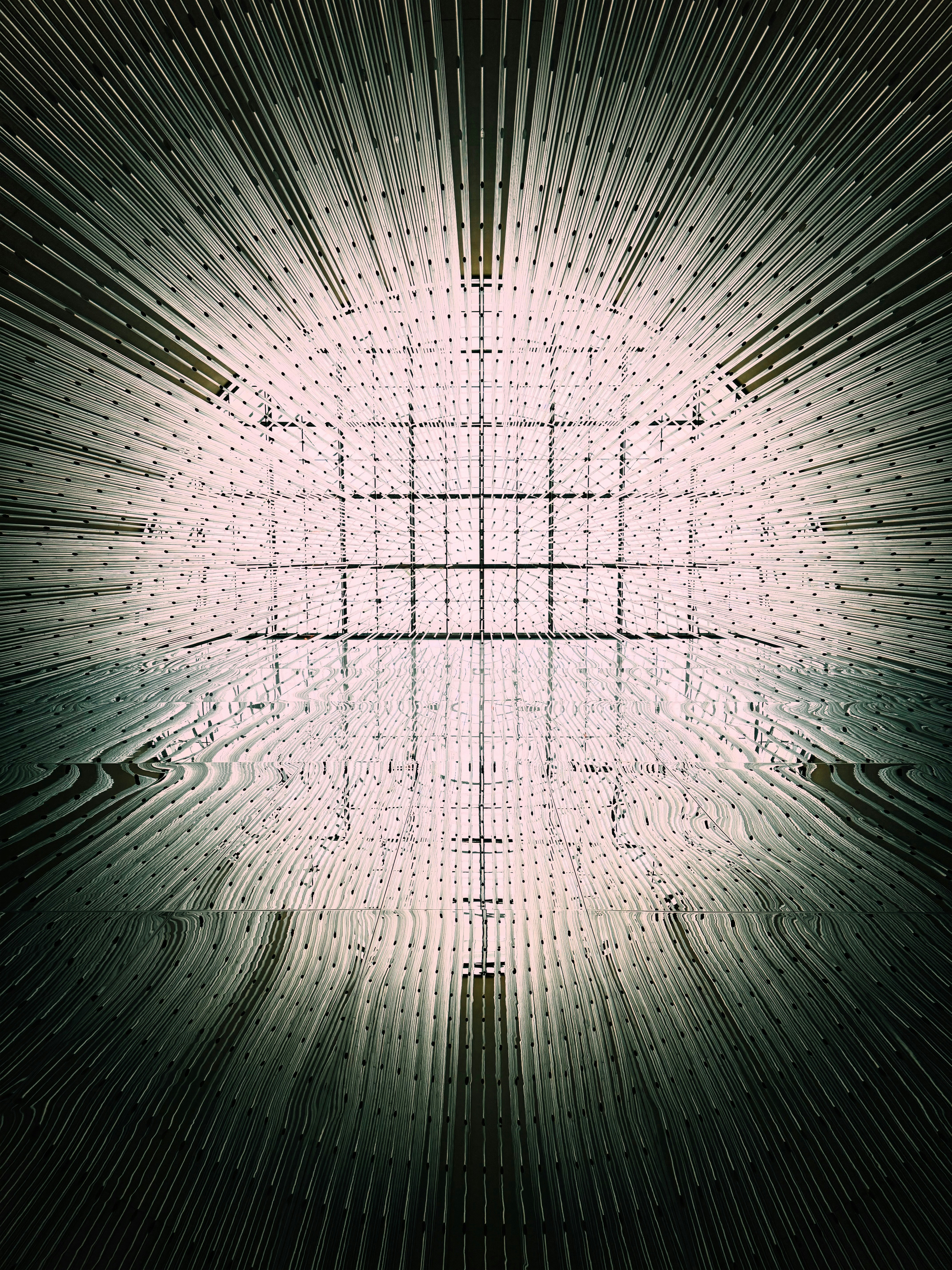 A very large square shaped object in the middle of a room photo – Free ...