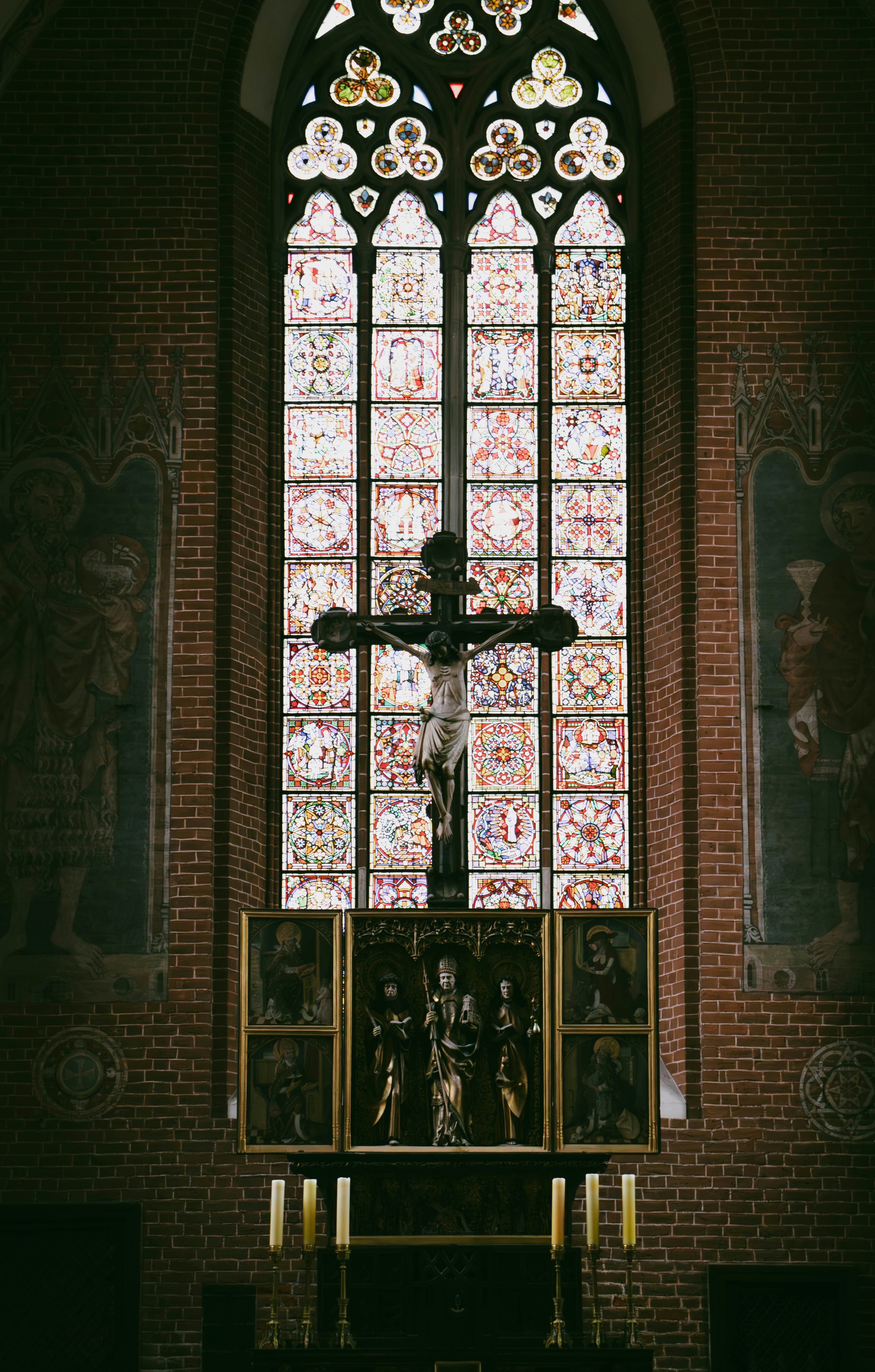 Crucifix at the Heart of a Luminous Gothic Window