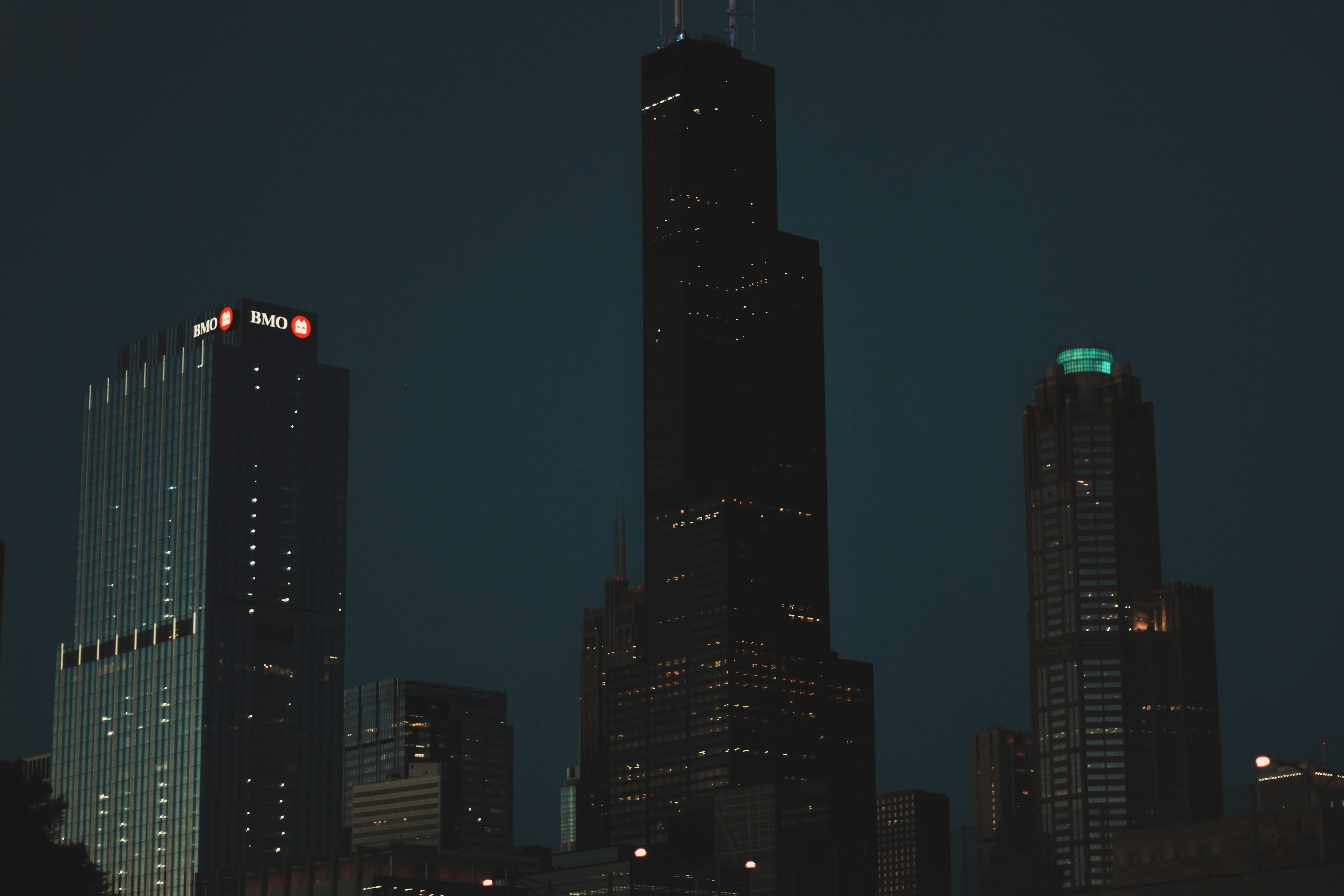 Nocturnal Monoliths: A Central Tower Reigns Over a Quiet Cityscape