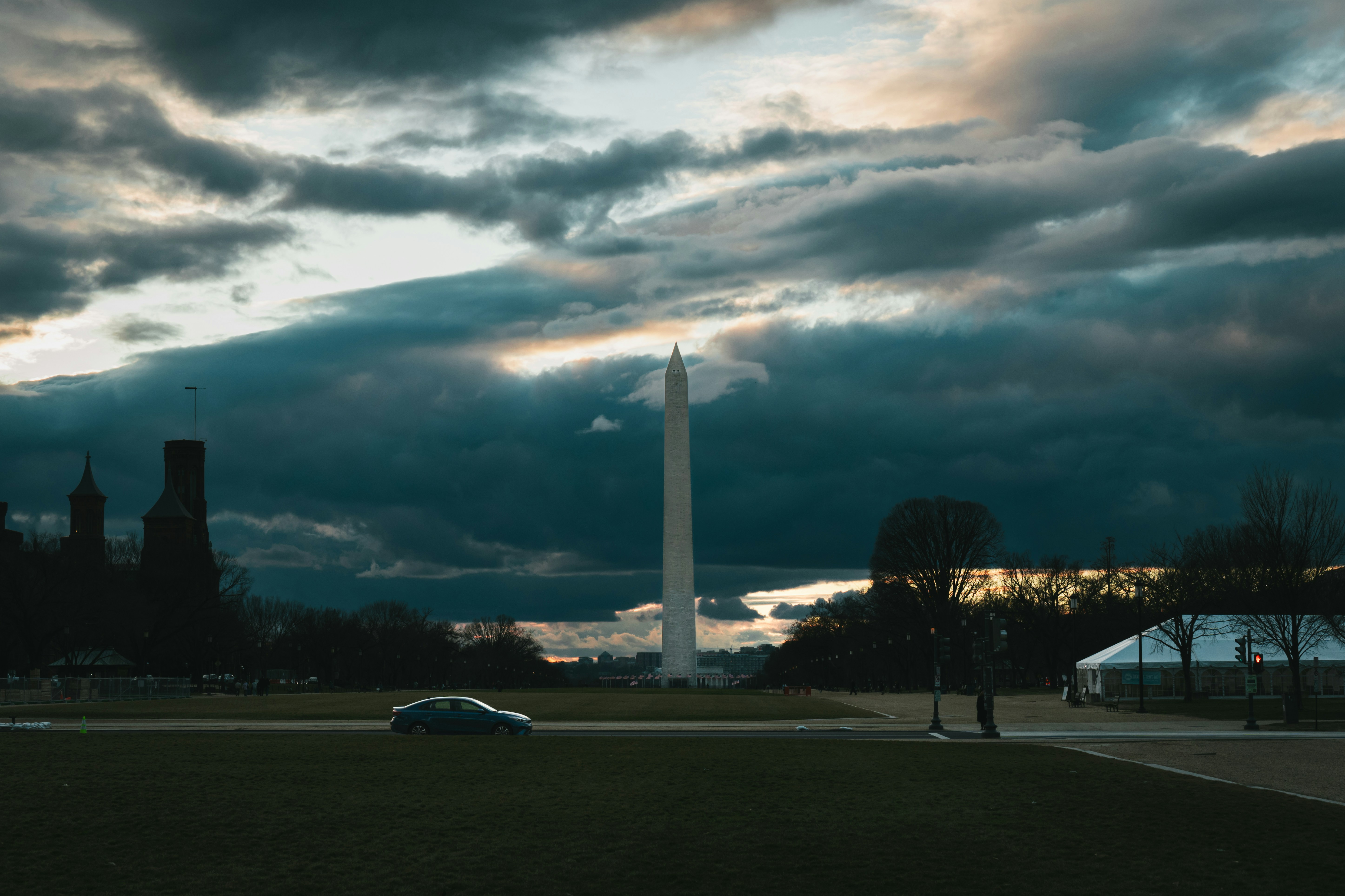 A car is parked in front of the washington monument photo – Free Car ...