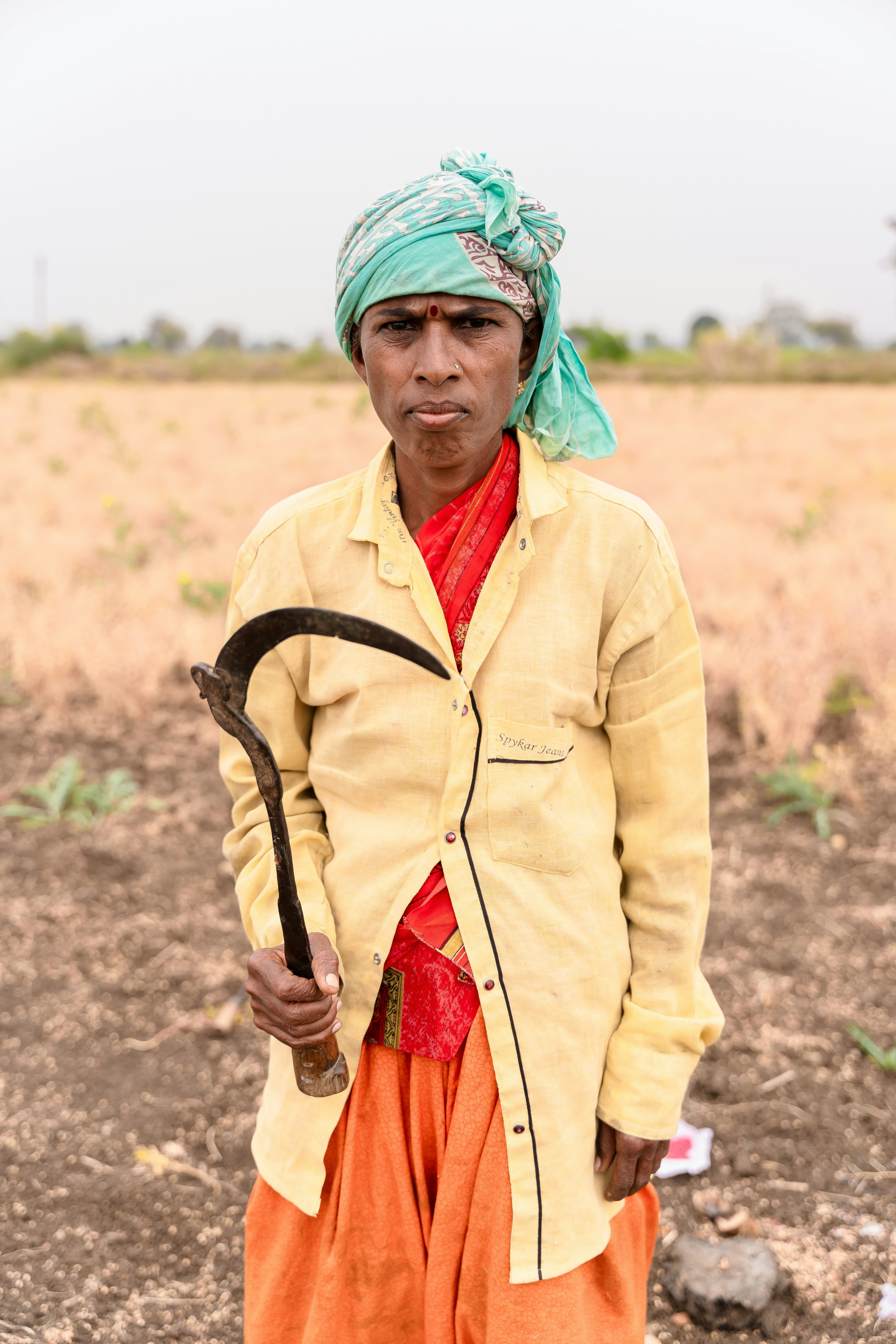 A man standing in a field with a pickle in his hand photo – Free Nagpur ...