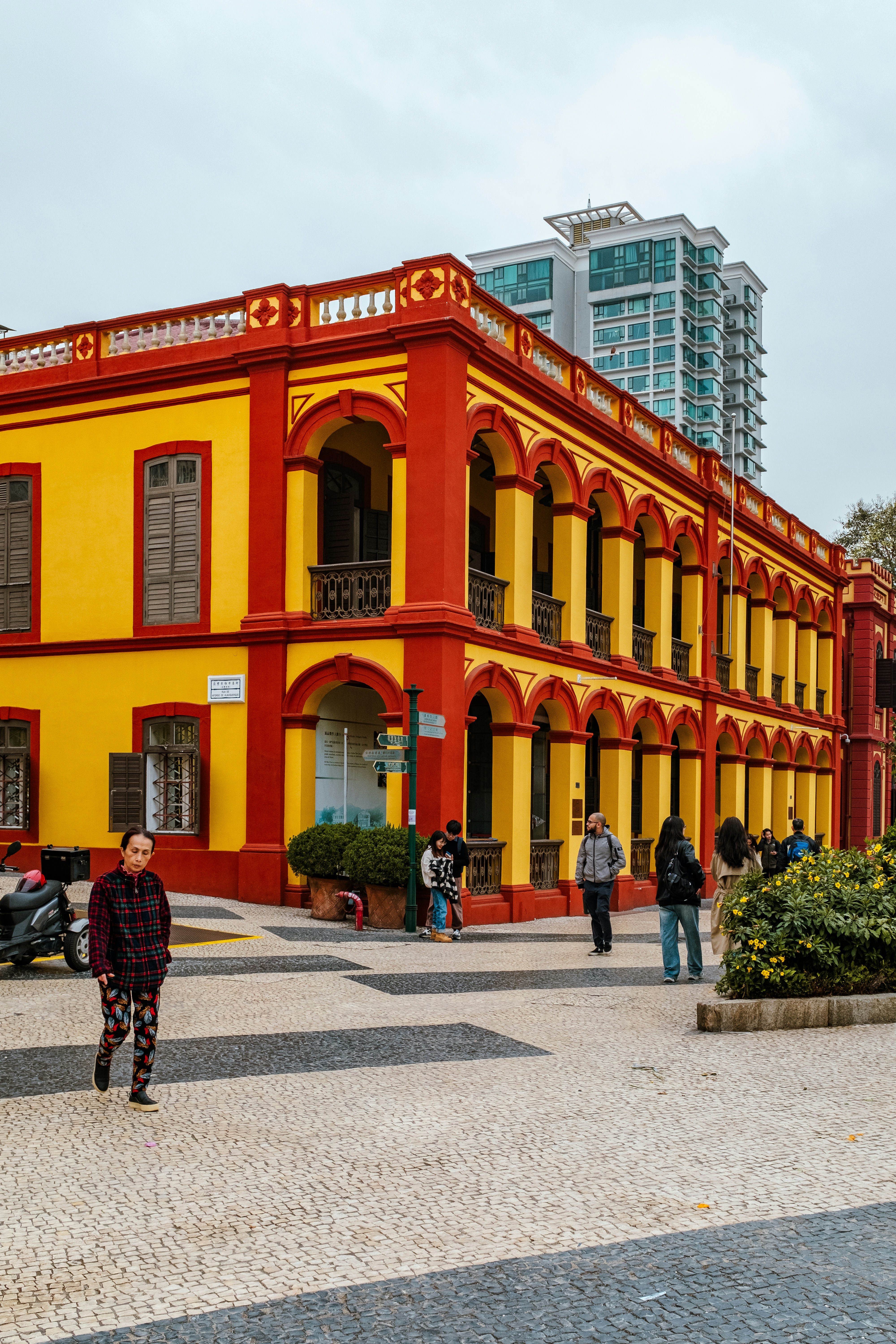Crimson Arcades: A Sunlit Block of Yellow and Red